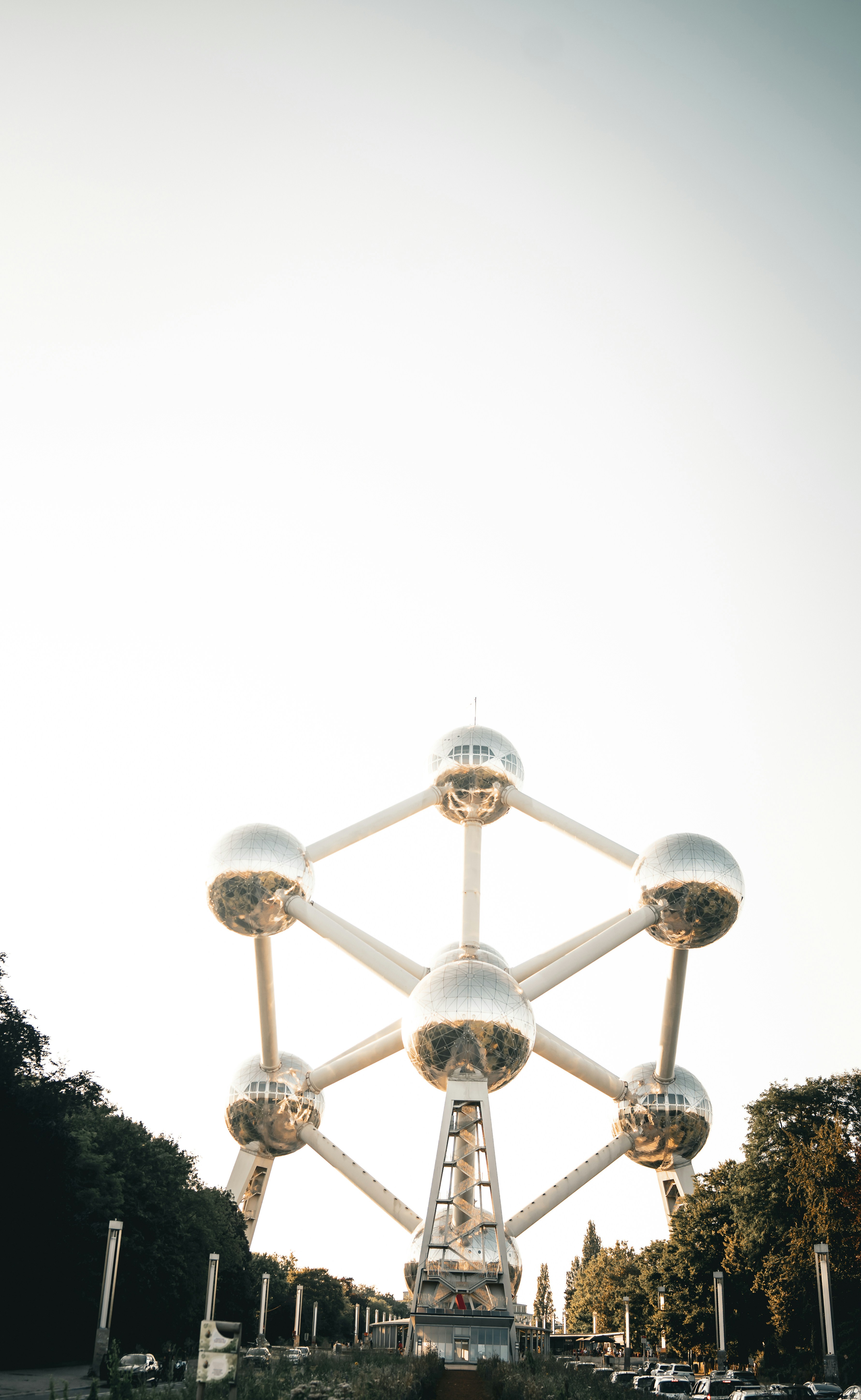 Sphere of Steel: The Atomium Rising Over Brussels Treeline