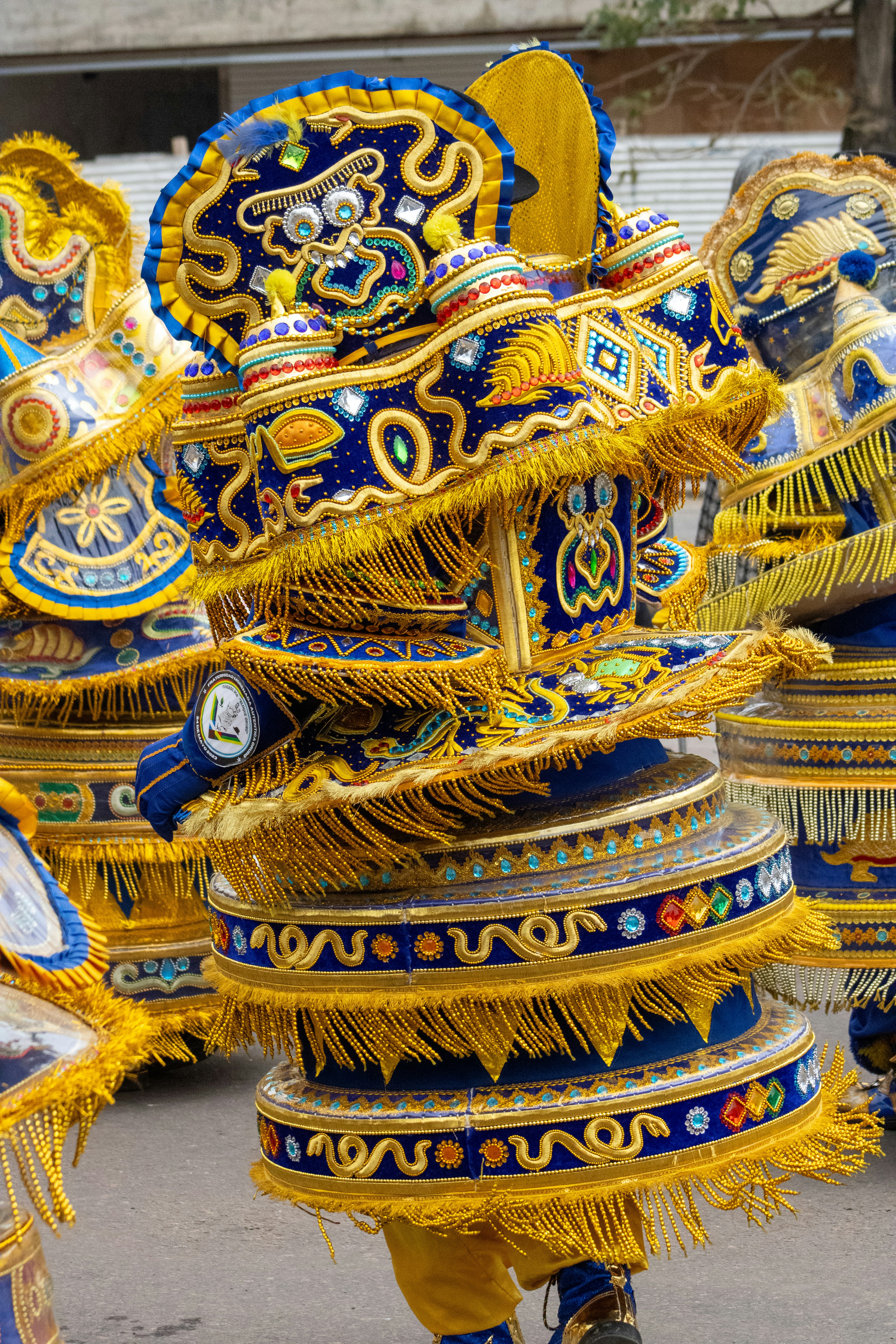 Ornate Carnival Headdress Stack: Gold, Blue, and Embellished Fanfare