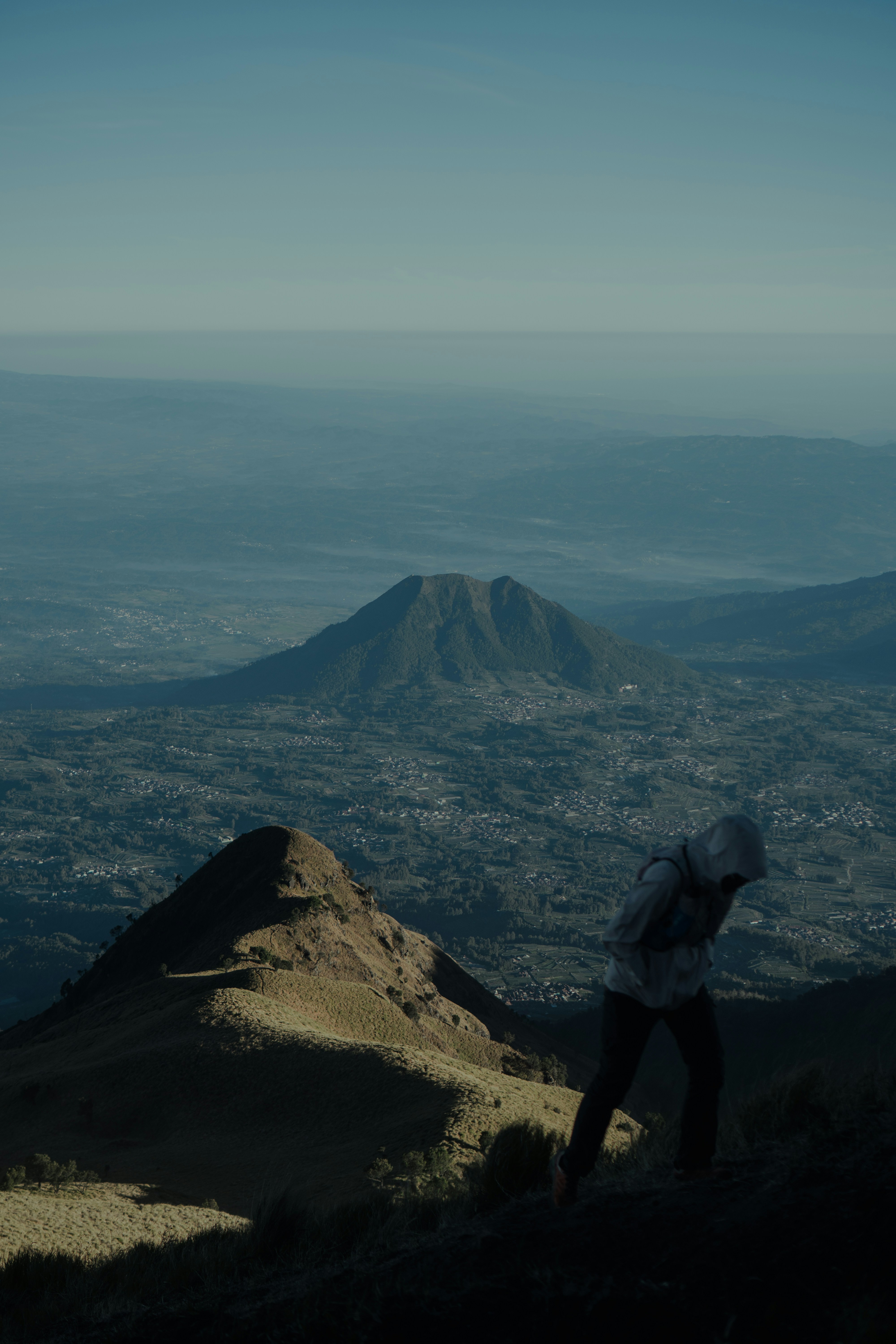 Horizon over Volcanic Ridge: A Hiker Pauses Above the Valley