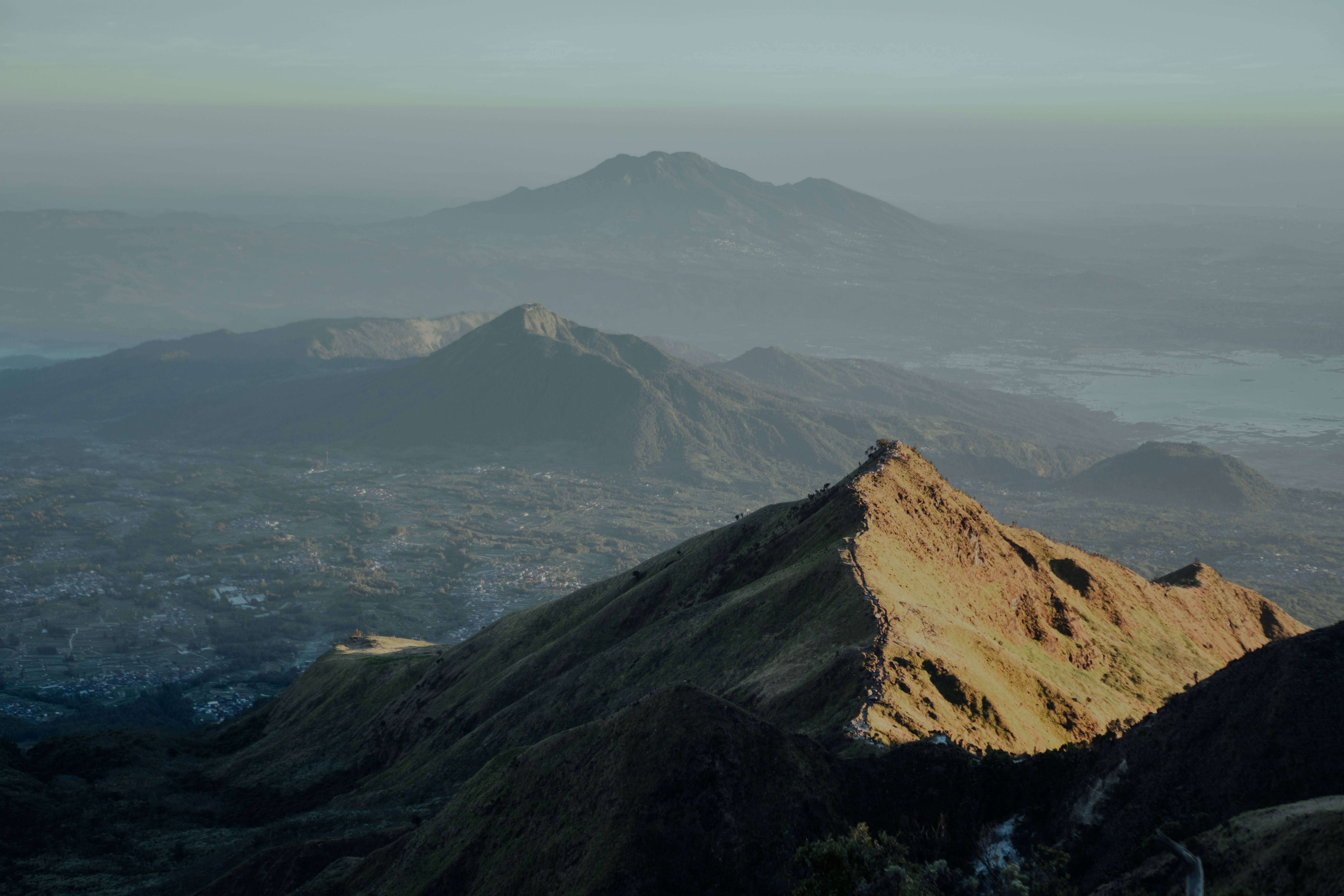 Sunlit Ridge: A Quiet Climb into the Morning Mist