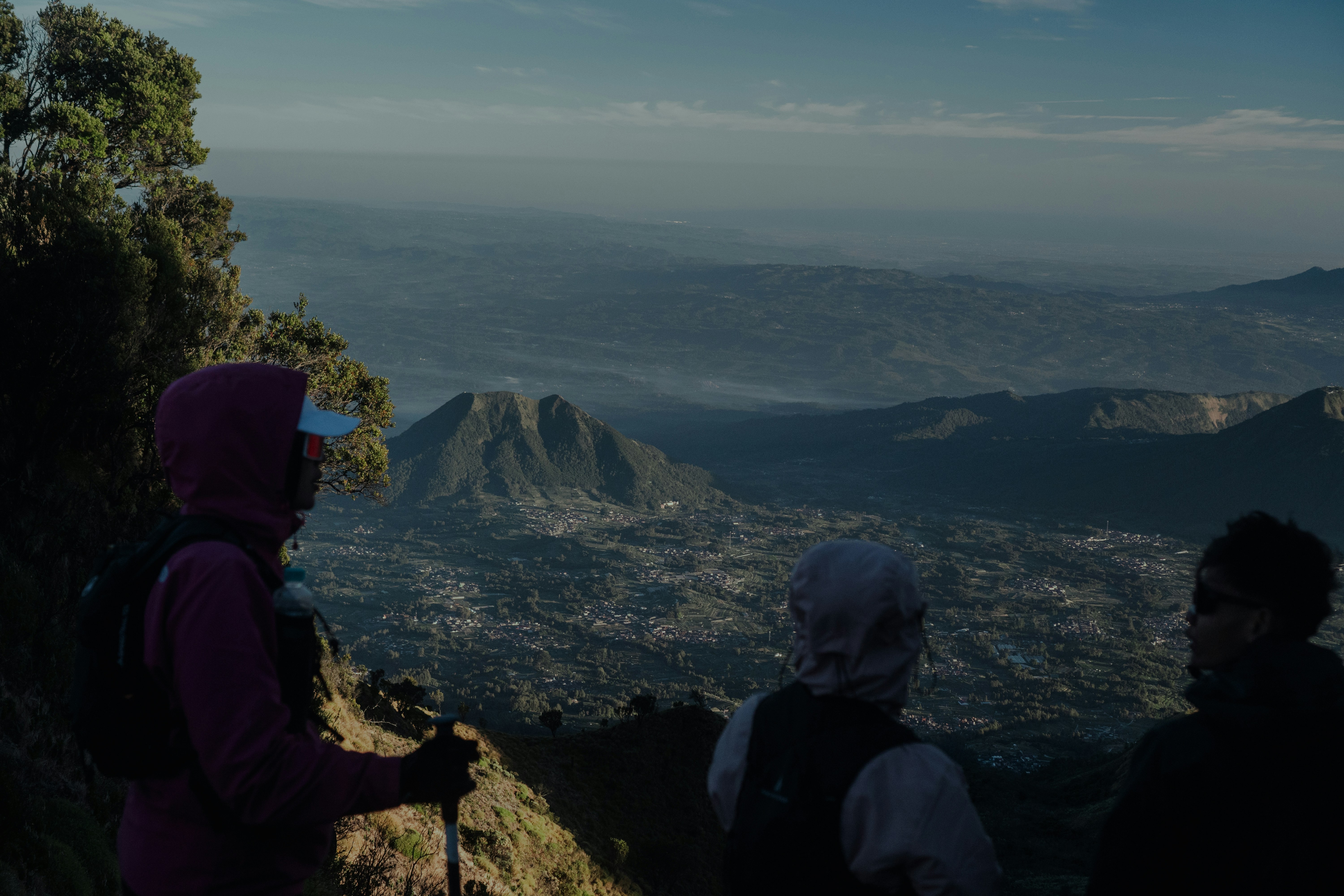 High-Elevation Pause: Friends on a Ridge Overlooking the Valley