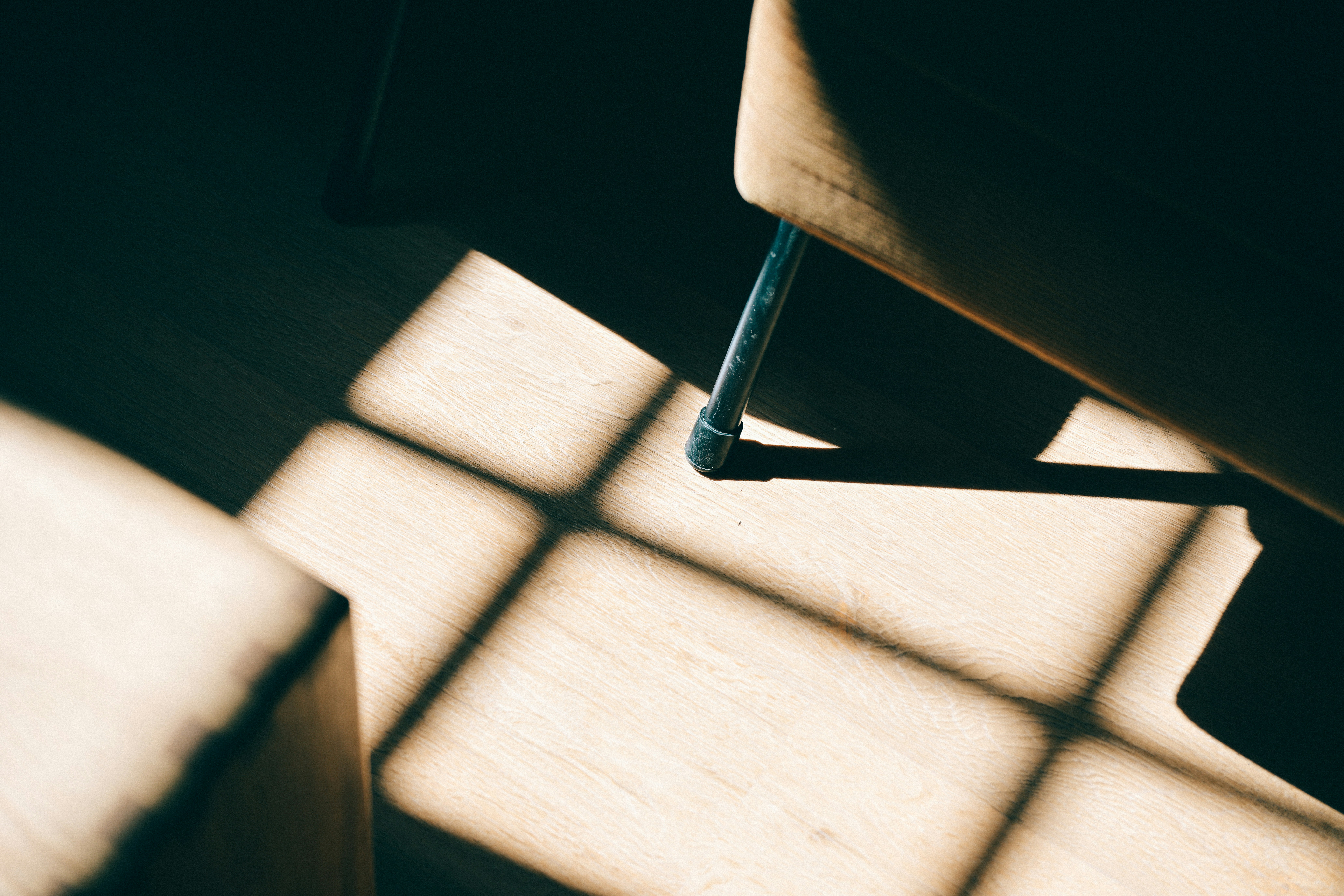 Shadowed Lines and Sunlit Angles on a Quiet Studio Floor
