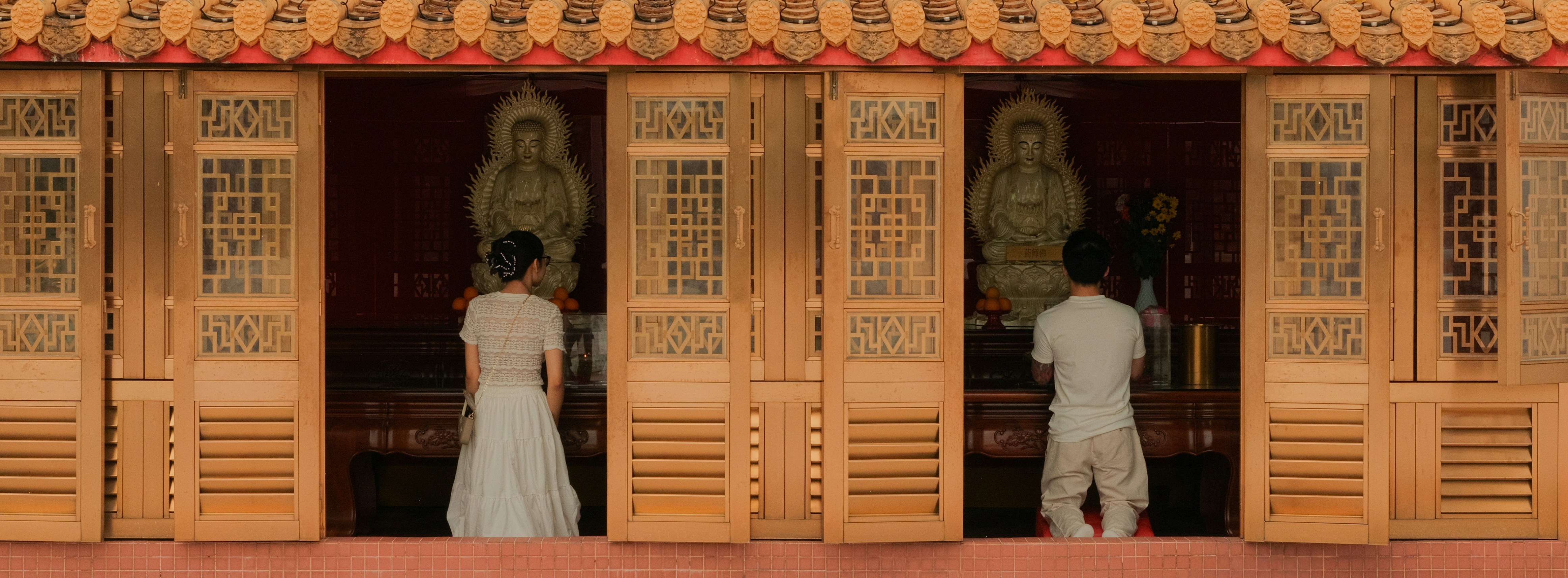Symmetry of Lanterns: Visitors in a Traditional Shrine Corridor