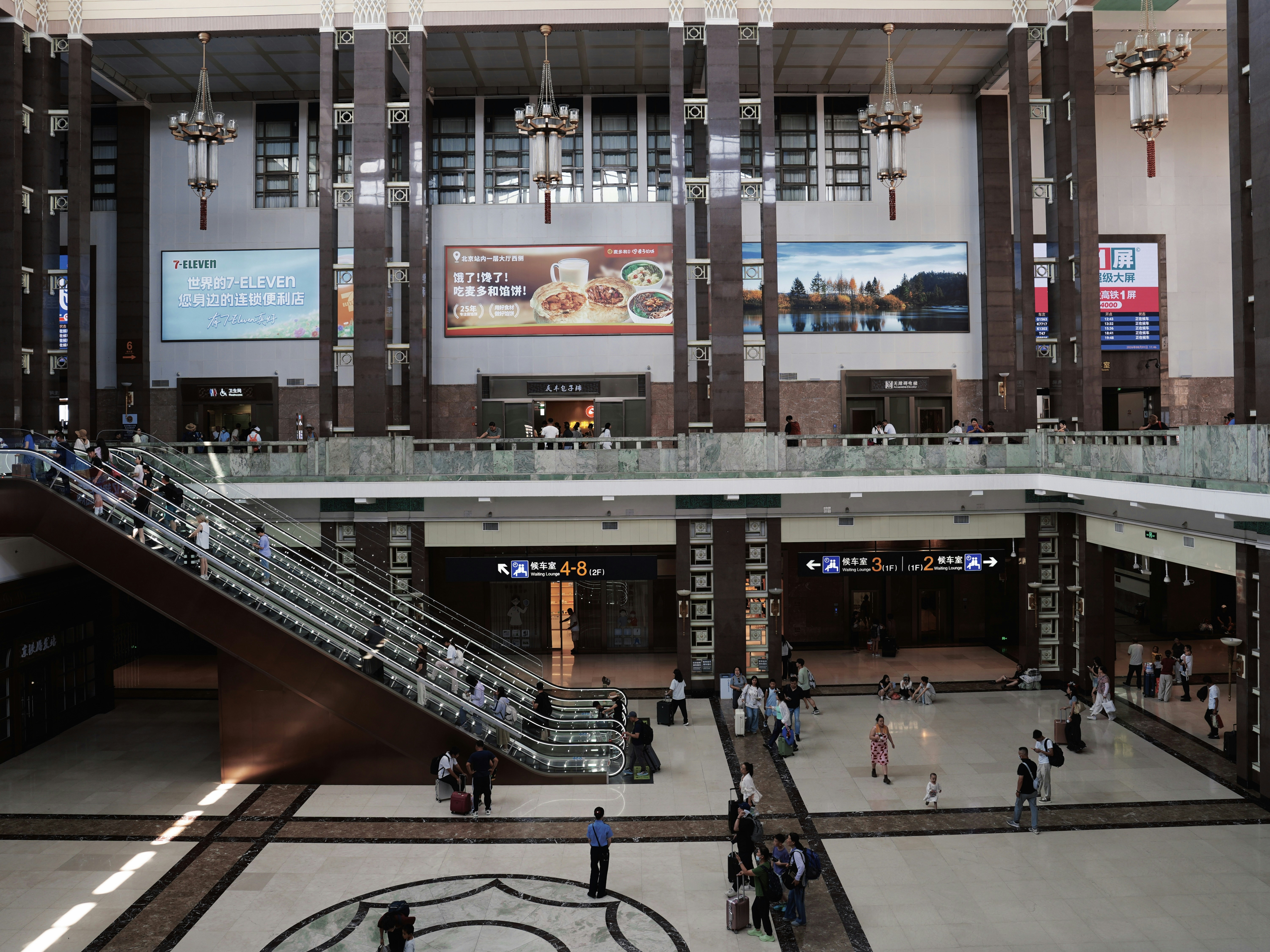 Atrium Echoes: Sunlit Hallways and Stairs in a Busy Transit Center
