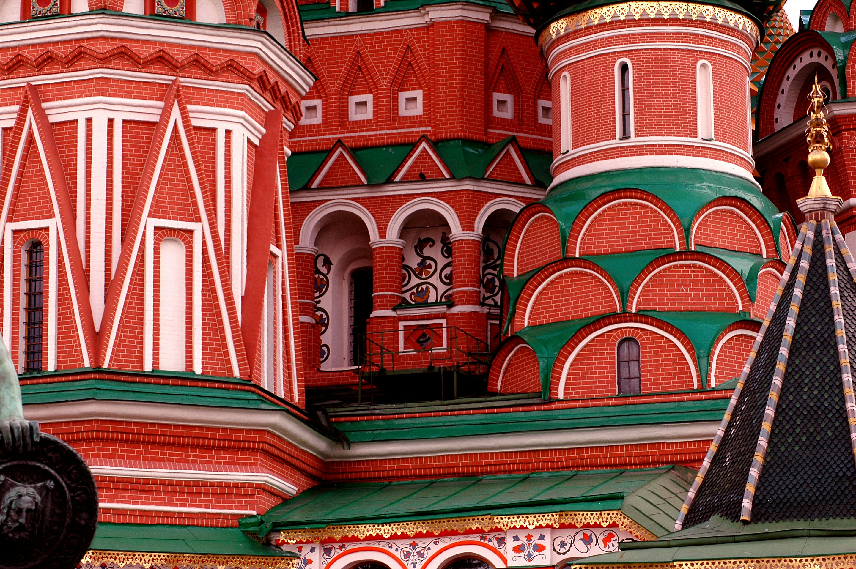 St. Basil’s Mosaic: Red Brick Patterns and Onion Domes in Sunset Light