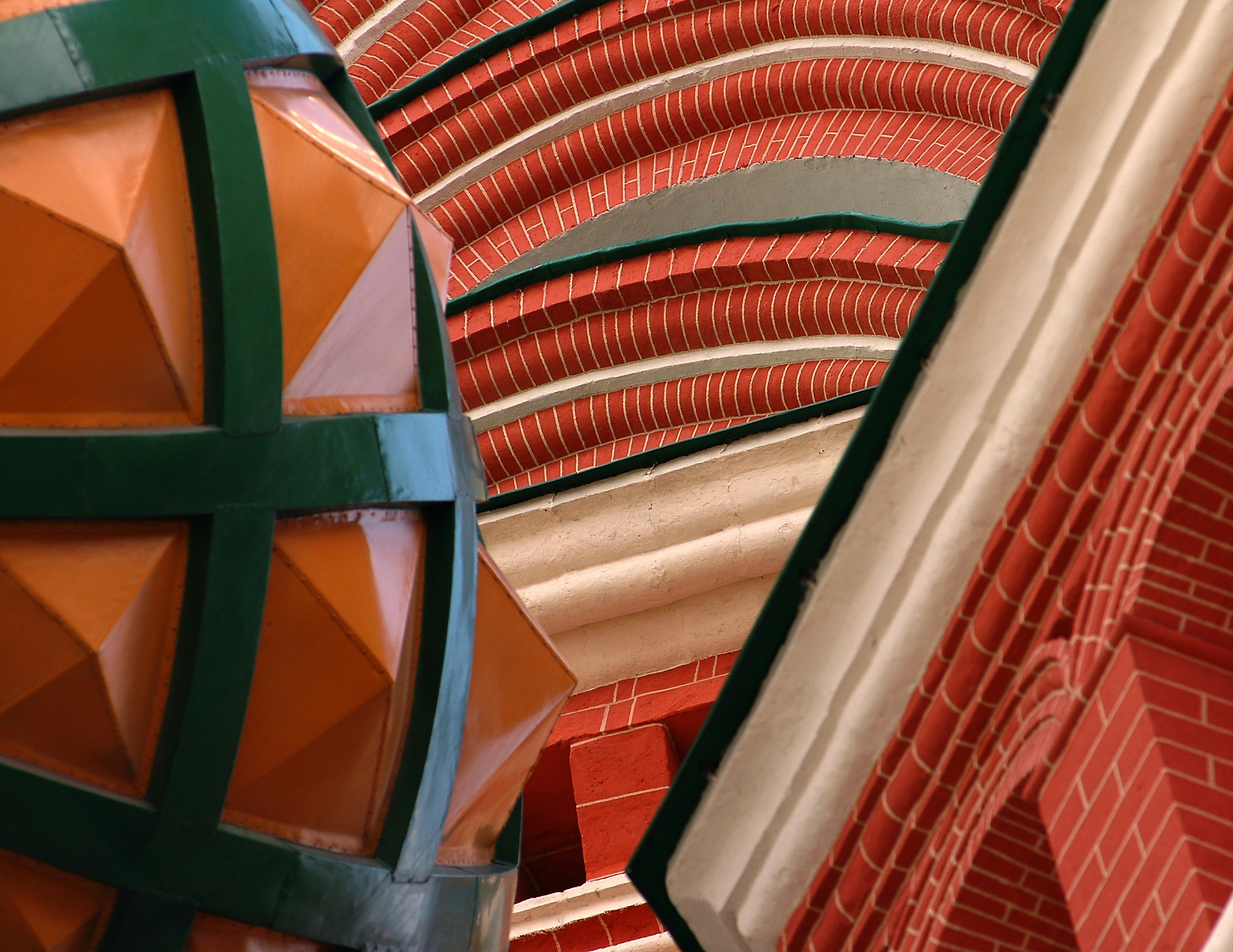 Geometric Dome and Brick Arcades: A Play of Colorful Facades