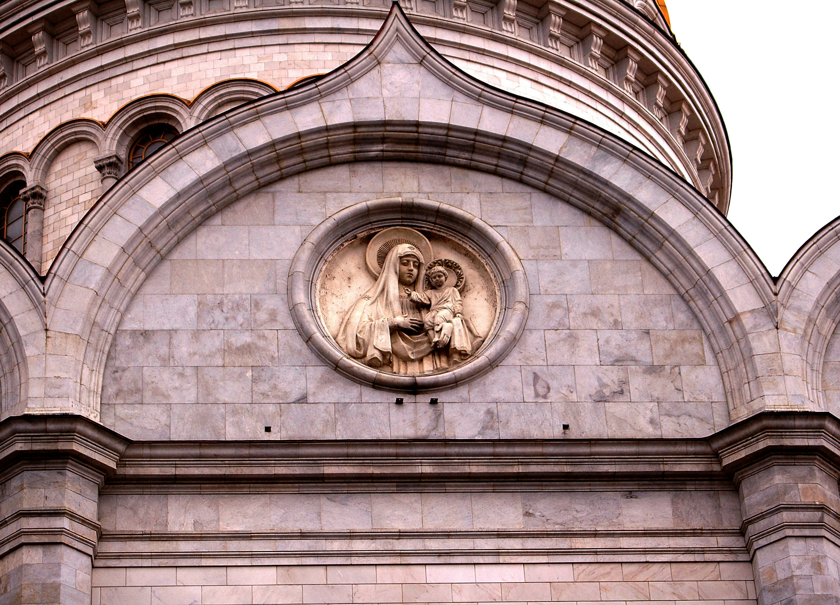 Stone Apse Relief: Sacred Matron and Child Encircled by Marble Arch