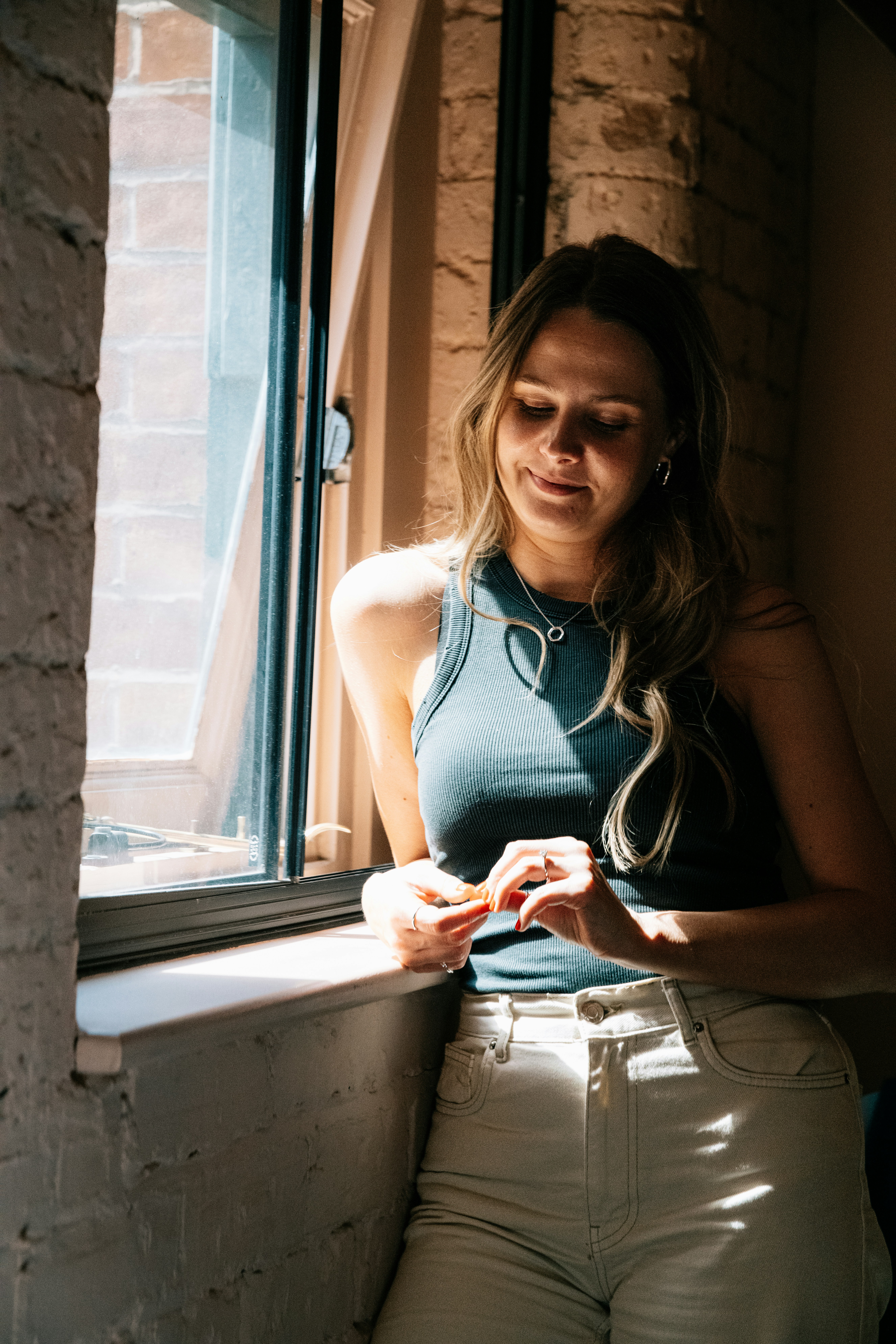 Soft Windowlight Portrait of a Woman in a Brick Studio