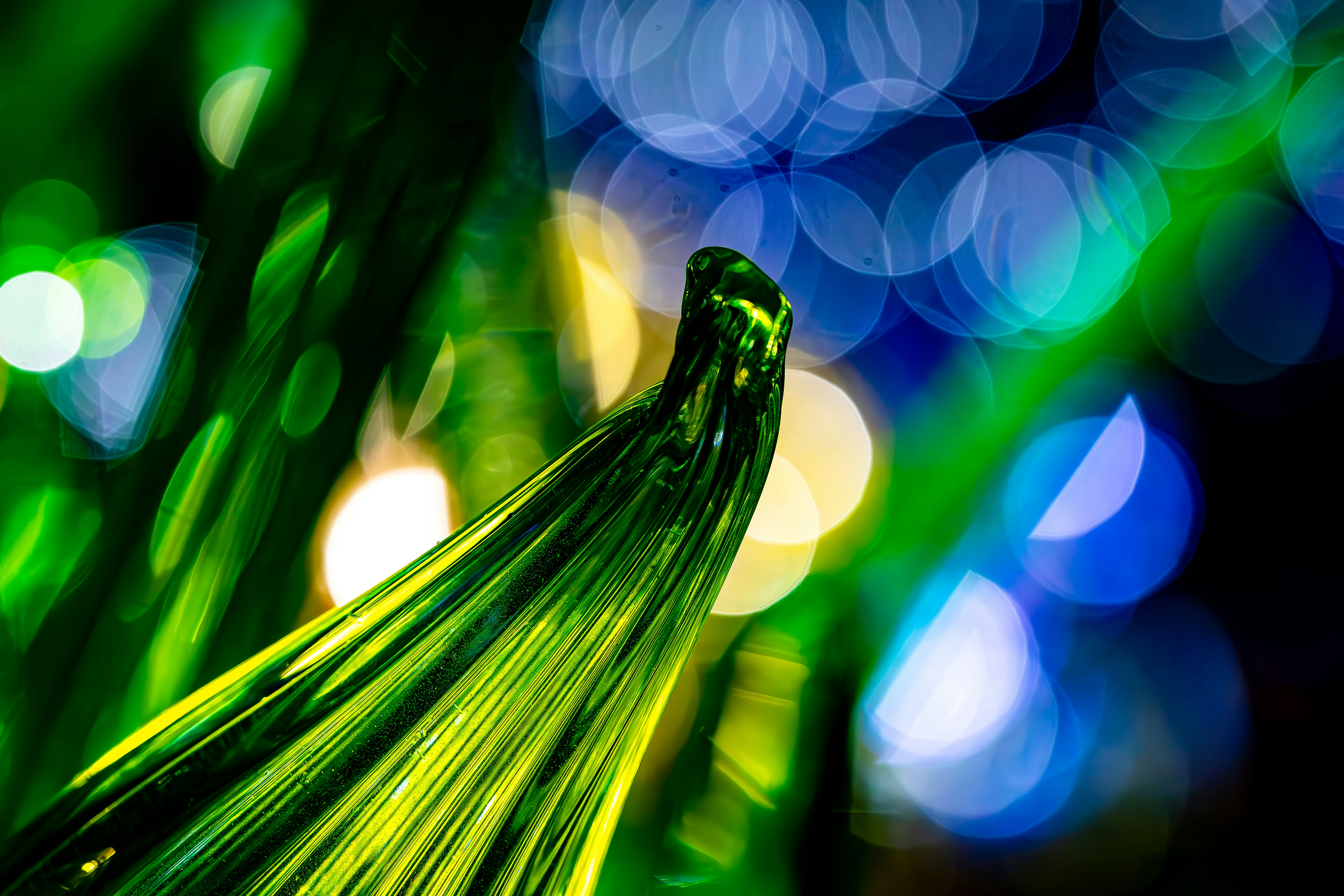 Glowing Green Spiral: A Macro Portrait of Glass Spirals Under Urban Lights