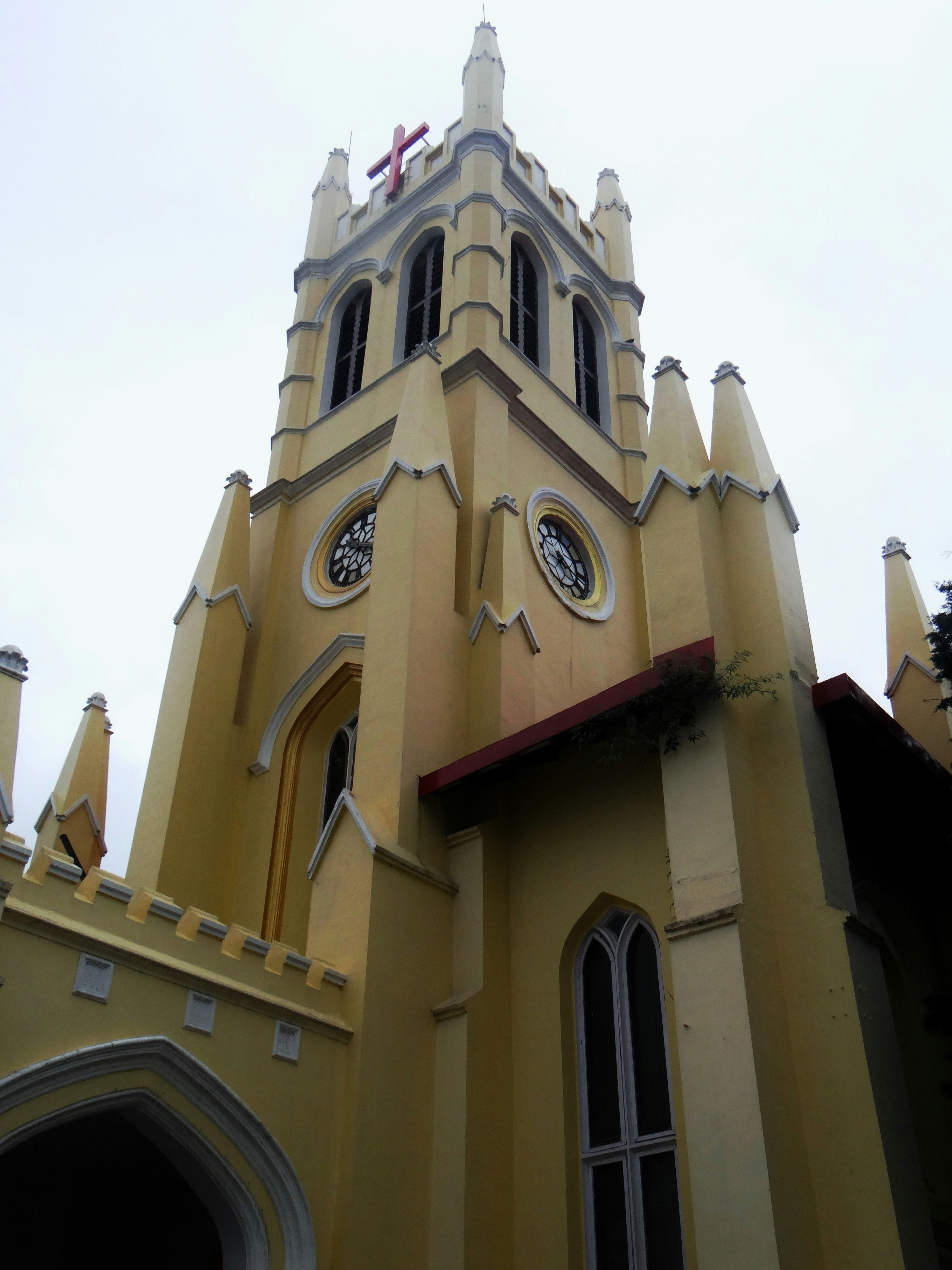 Vertical Crown: A Yellow Gothic Church Reaching Toward the Sky