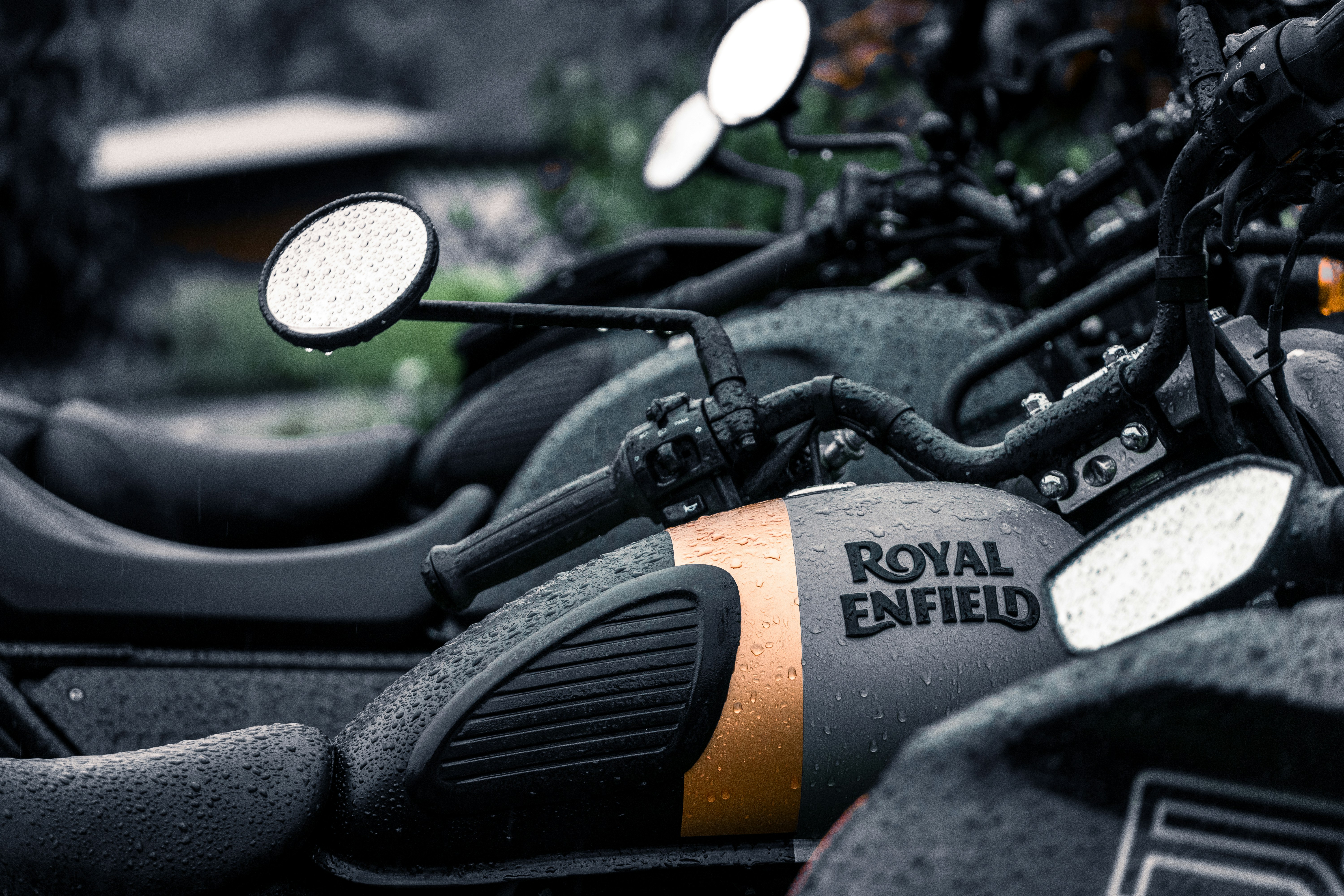 Chrome Beads and Royal Enfield: A Rain-Kissed Bike Row