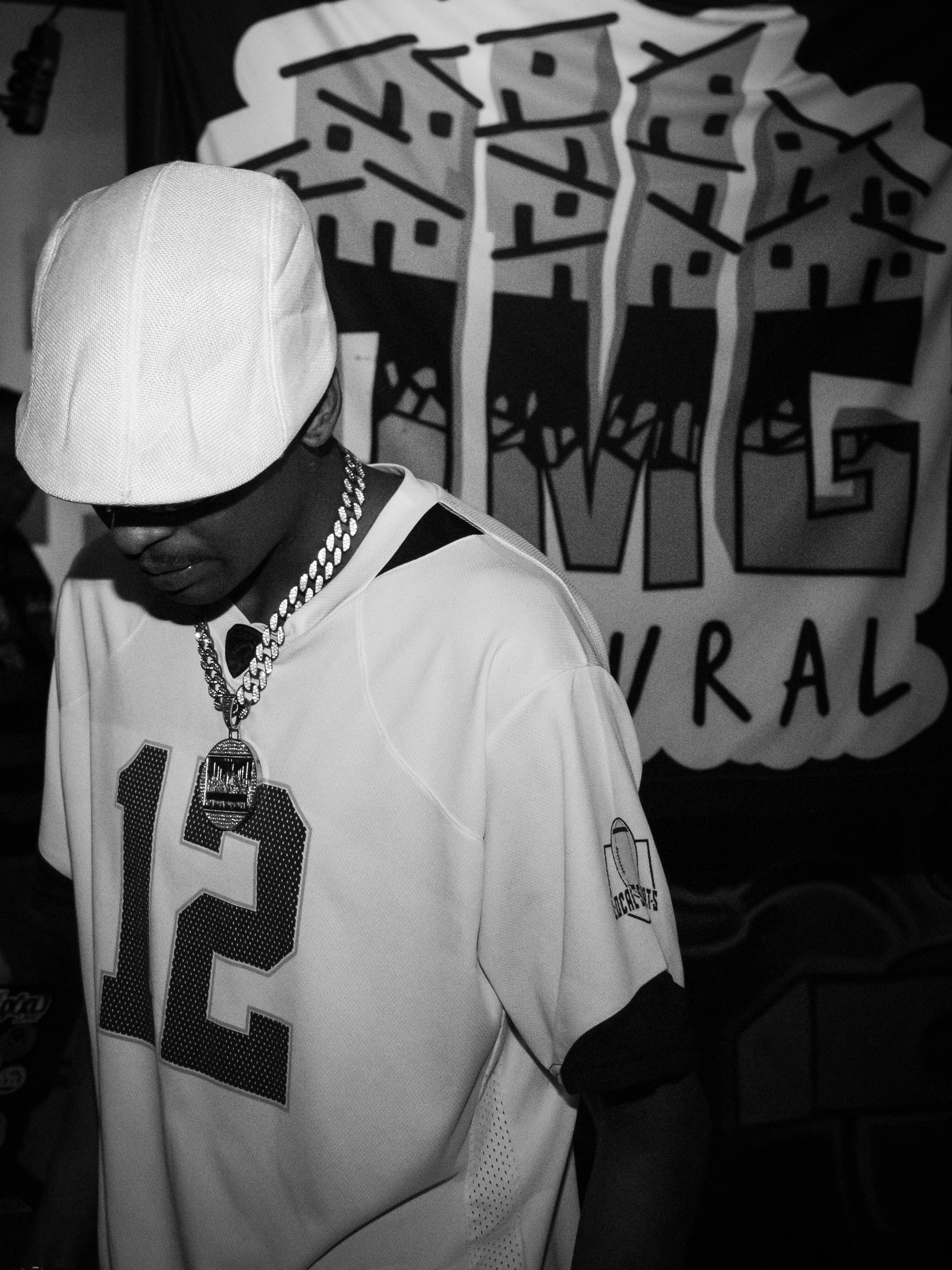 Shadowed Cap, Sharp Jewels: A Quiet Moment in Graffiti Glow