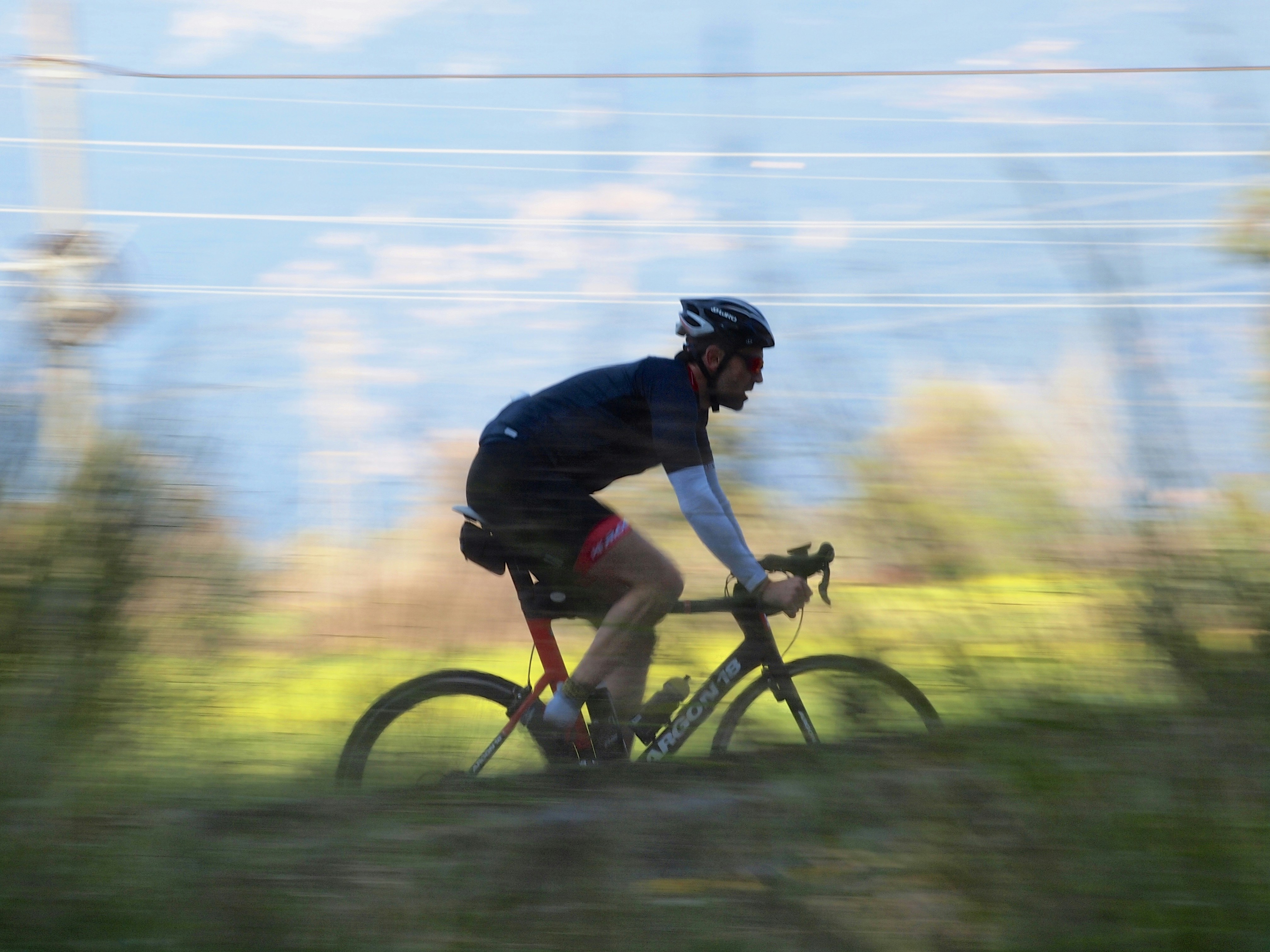 Blurring Toward the Horizon: Cyclist in Motion