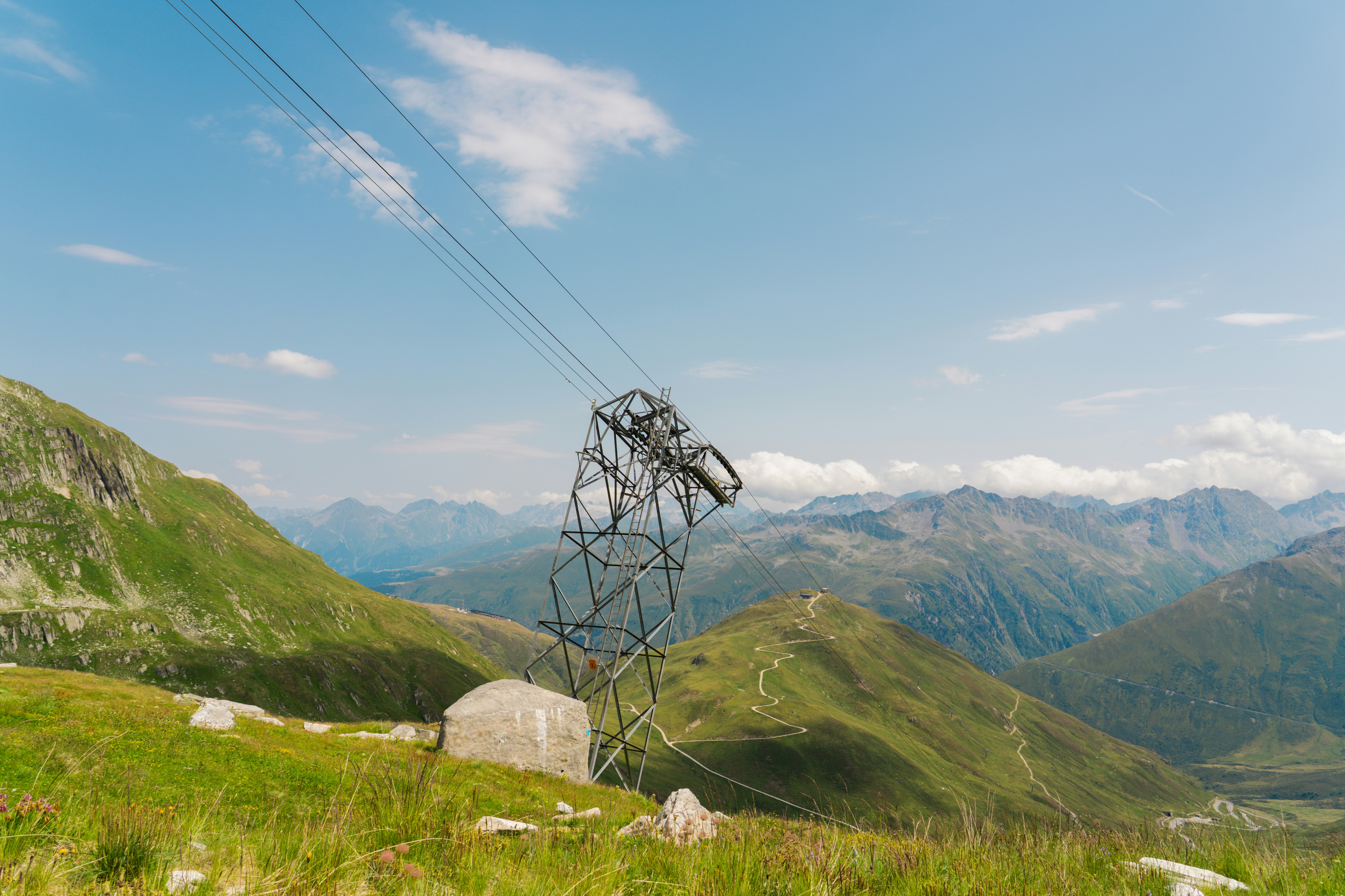 Powerline Tower with Alpine Landscape