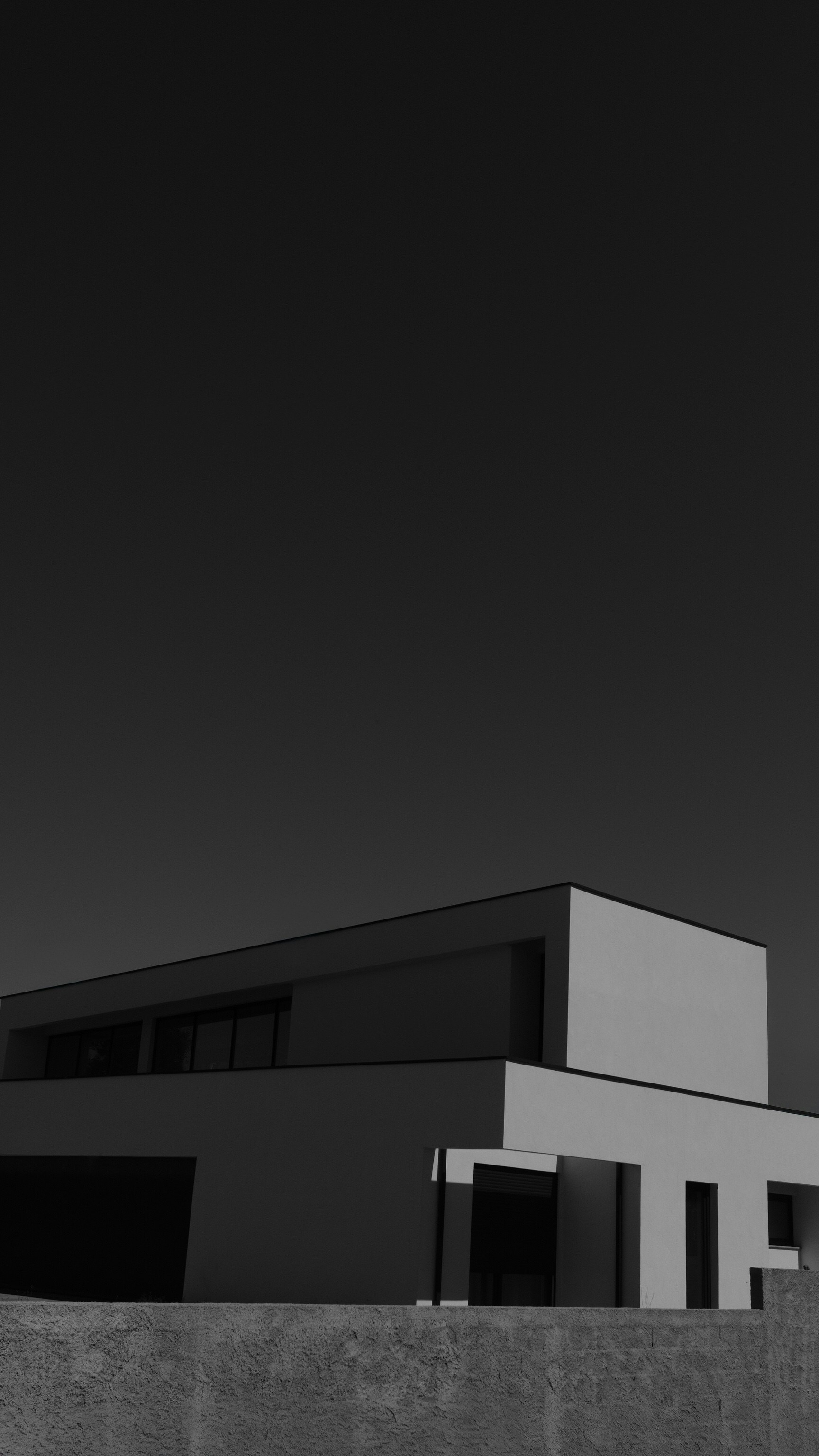 Minimalist Modernist: A Monochrome House Anchored by Sharp Angles