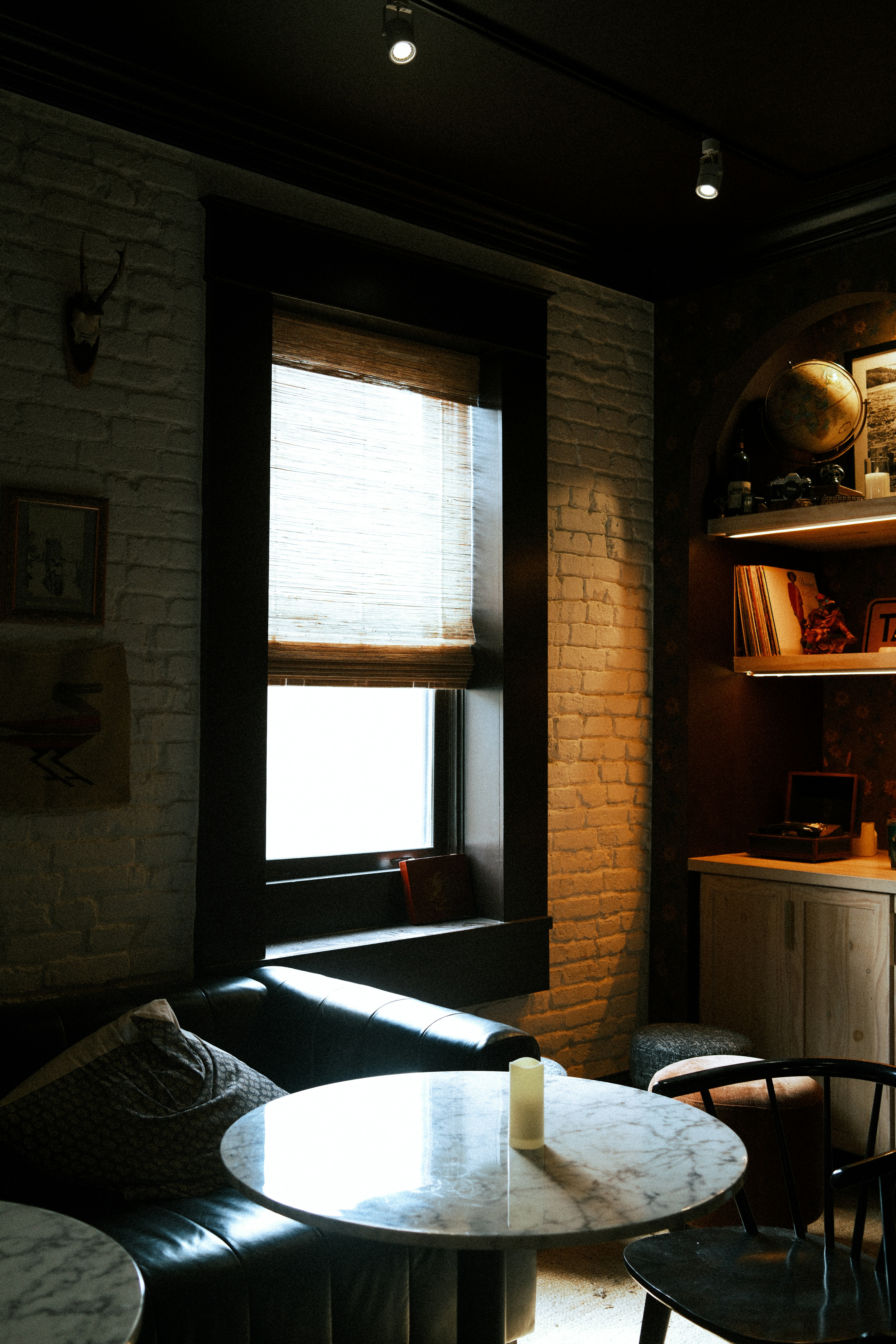 Quiet Corner Café: Window Light and Marble Table