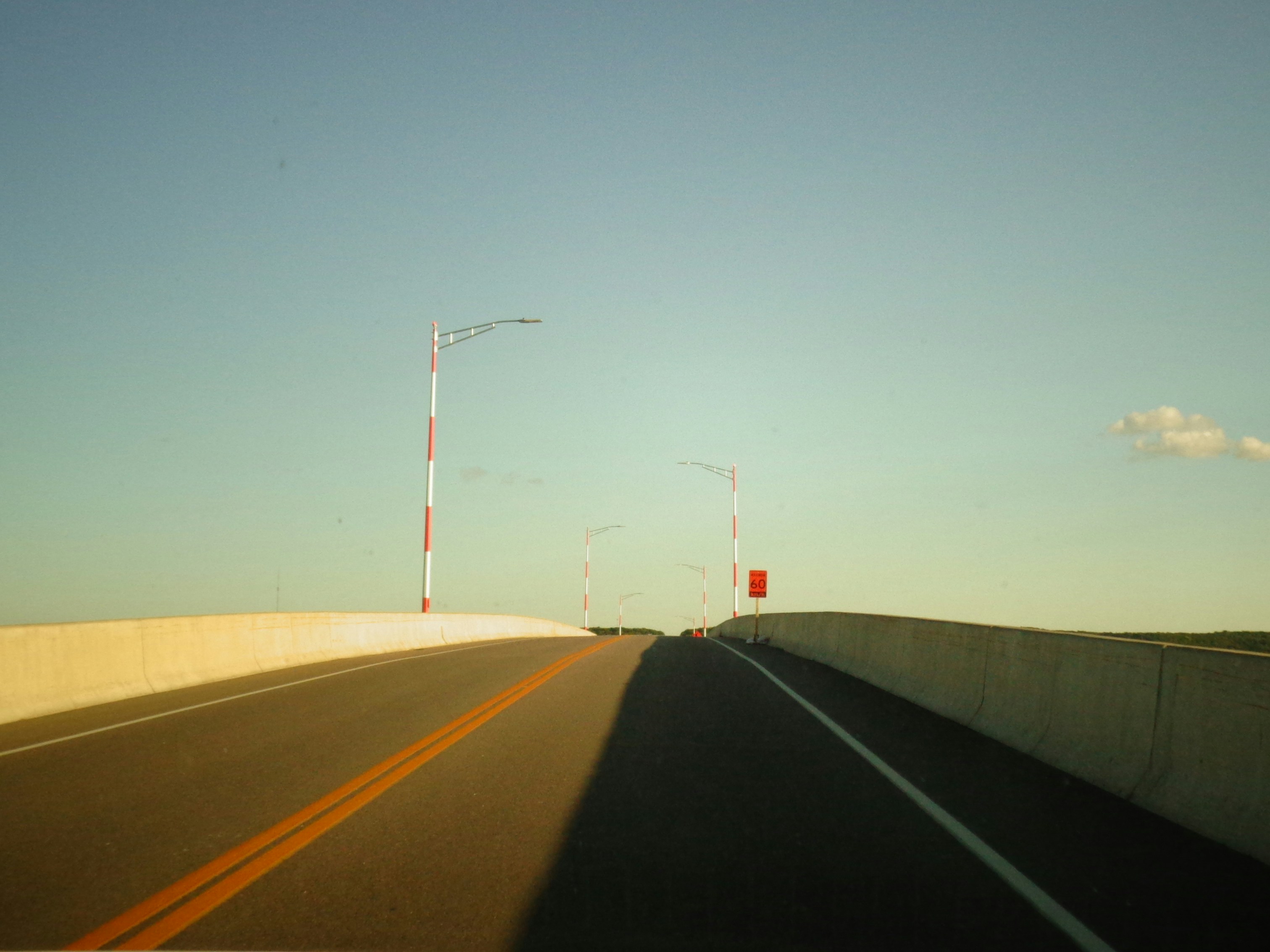 Shadowed Highway Crossing: A Quiet Bridge into Daylight