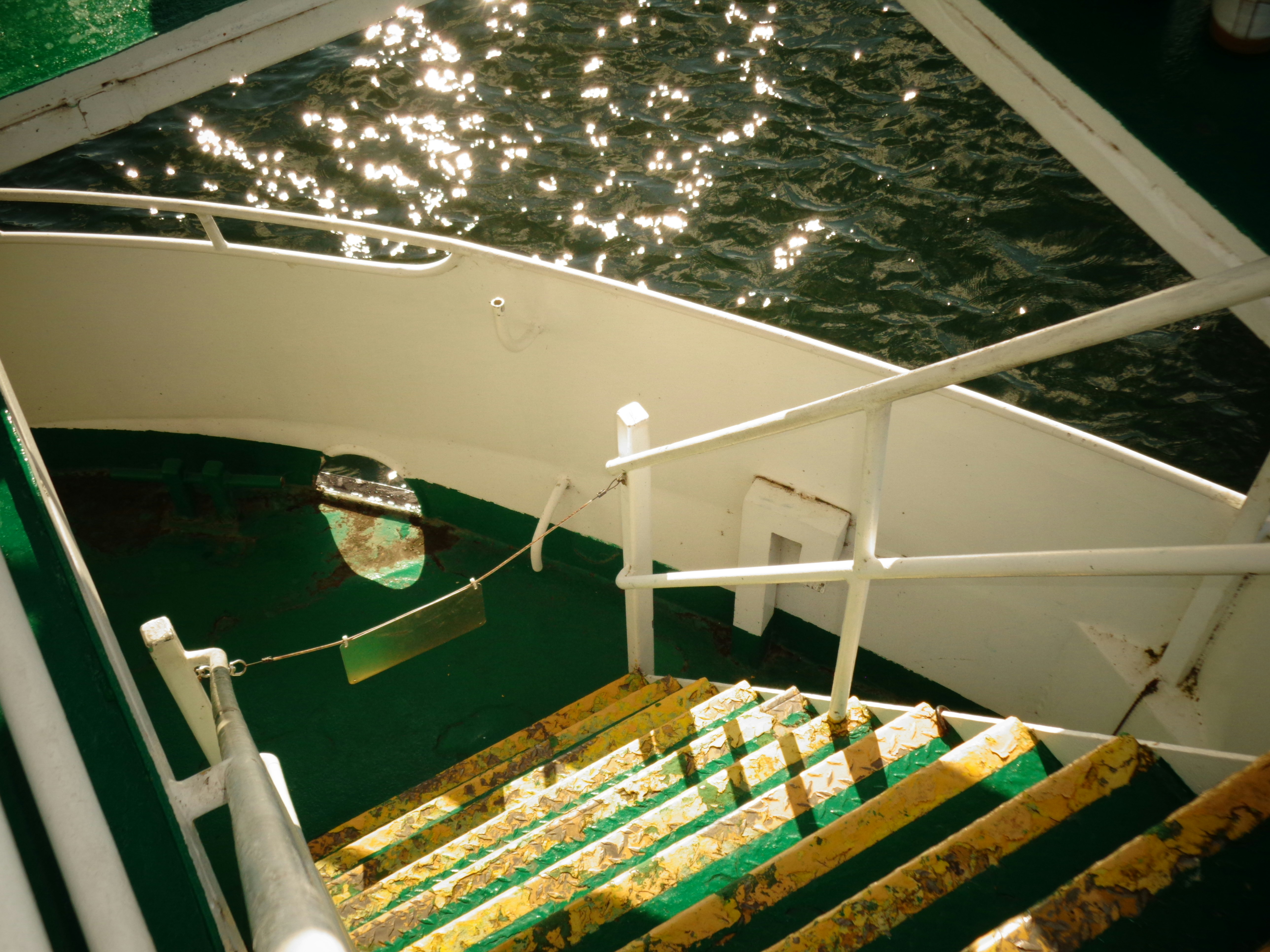 Rusted Steps to the Water: A Dockside Moment