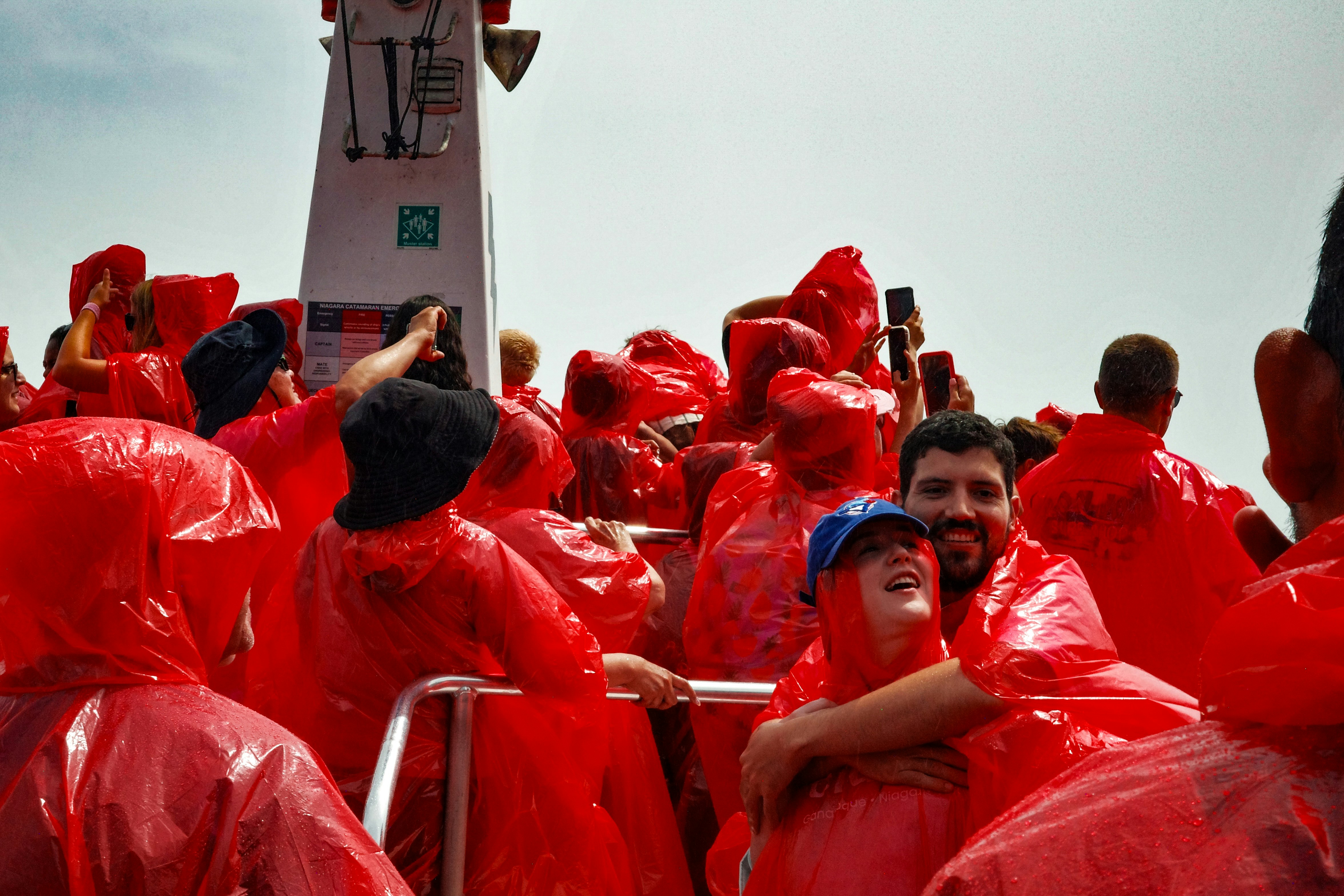 Red-clad Confession: A Grinning Moment Amid the Crowd
