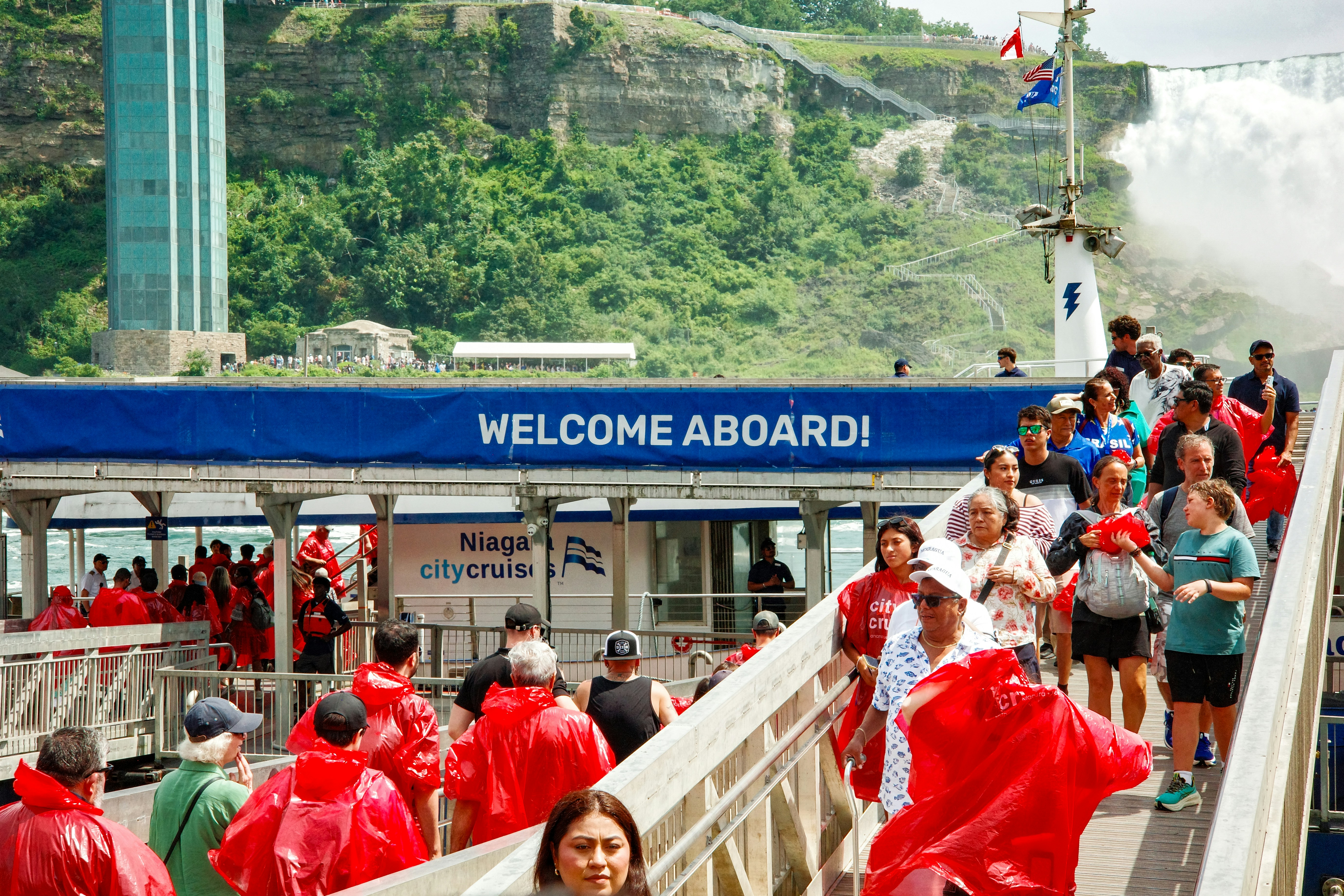 Crowd Crossing the Niagara Gorge Skywalk with Welcome Aboard Banner