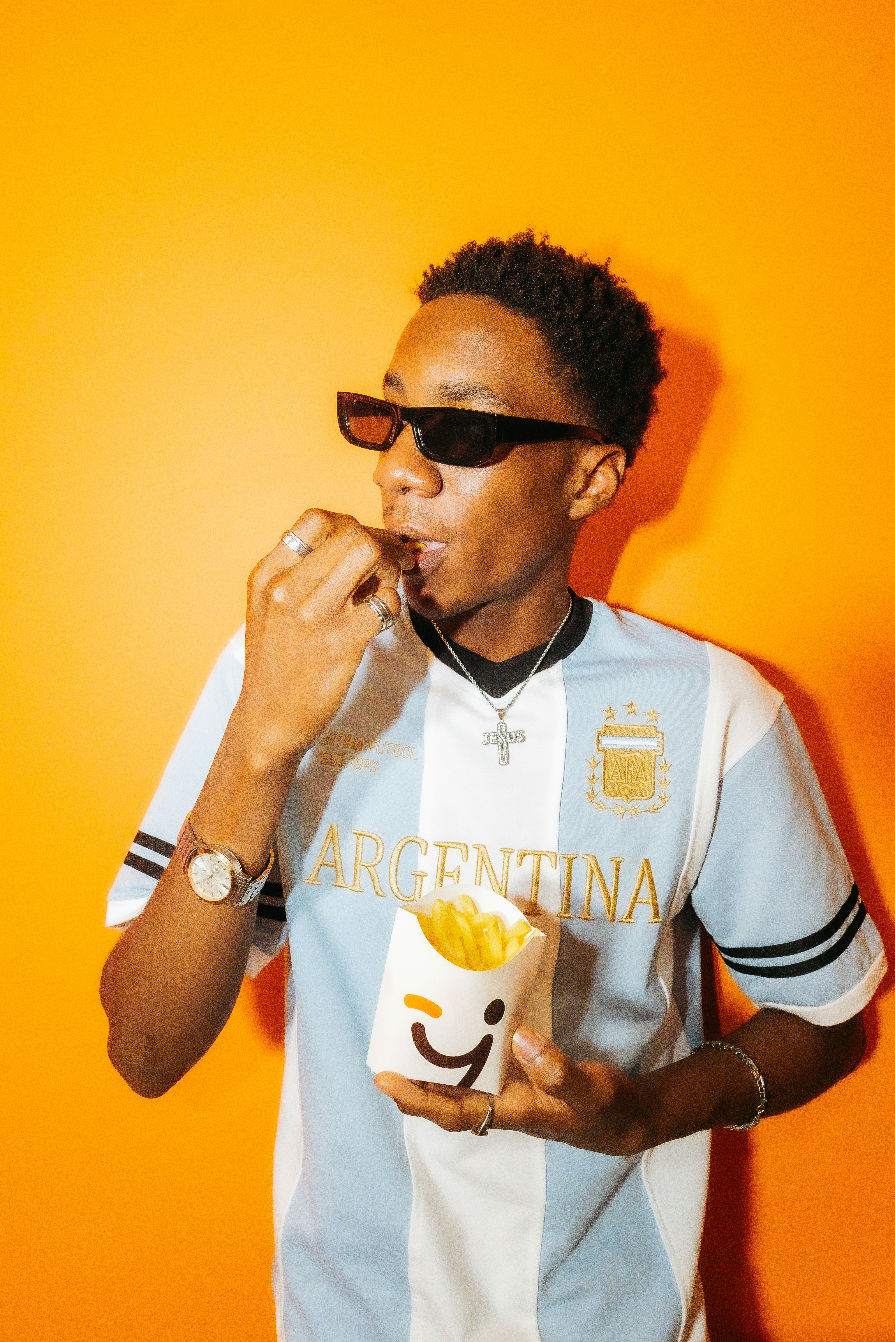 Orange Backdrop, Blue-White Stripes: A Casual Snack Break