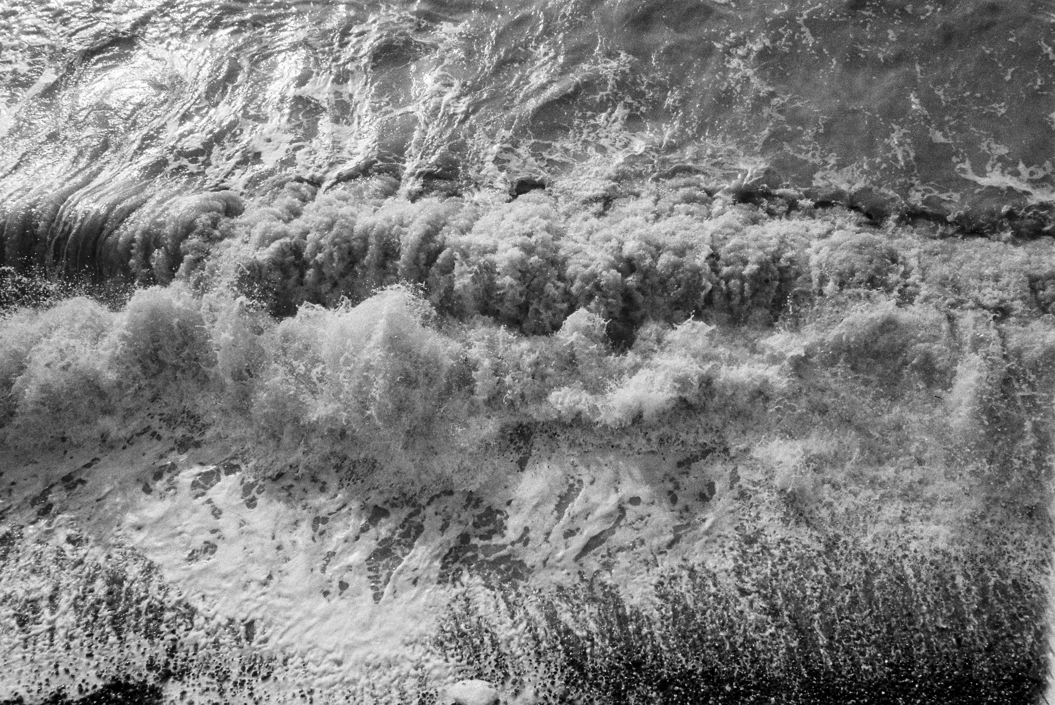 Curving Break: A Wave Crest in monochrome foam