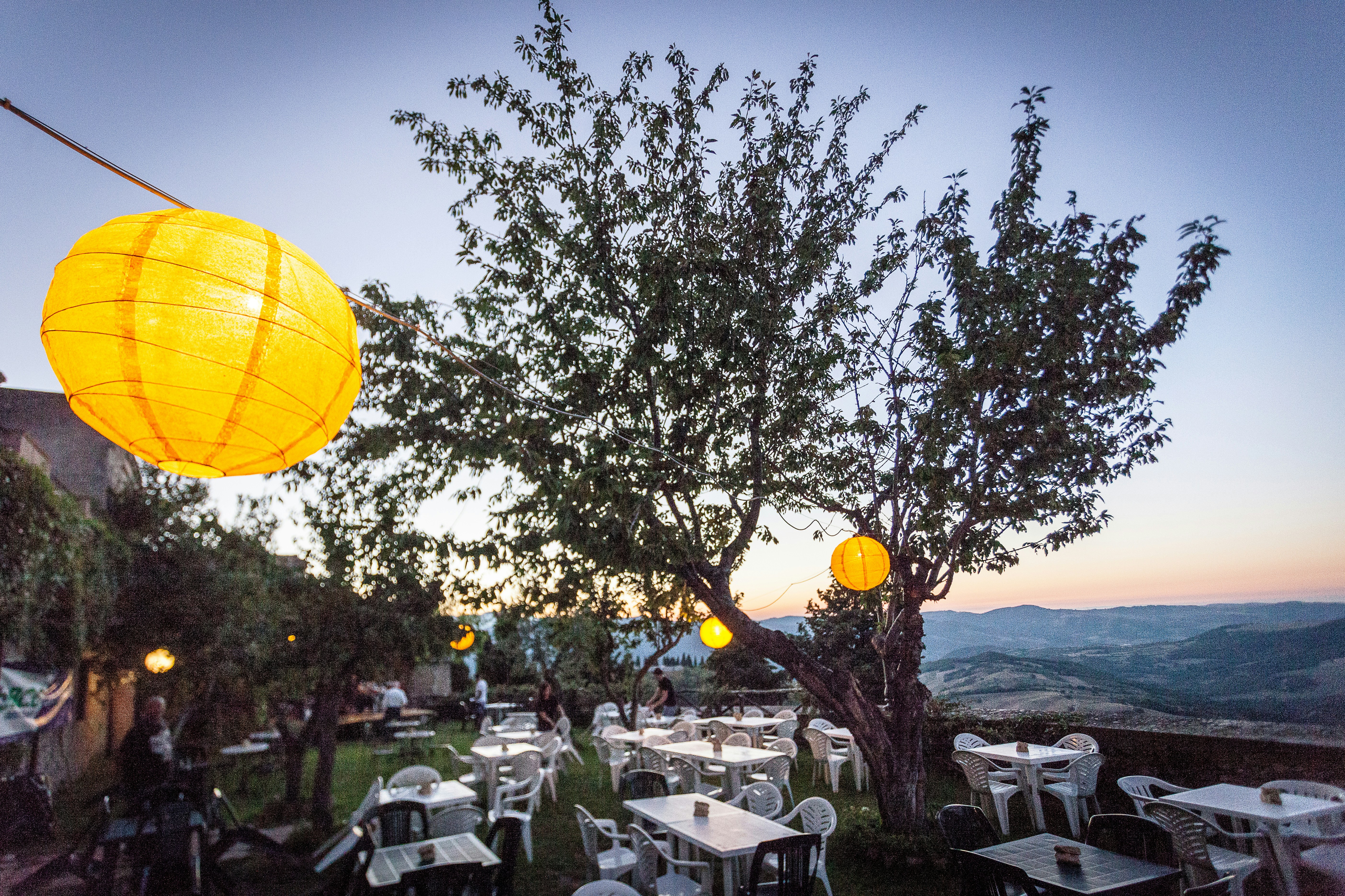Lanterns Over the Terrace: Dusk at the Olive Orchard Café