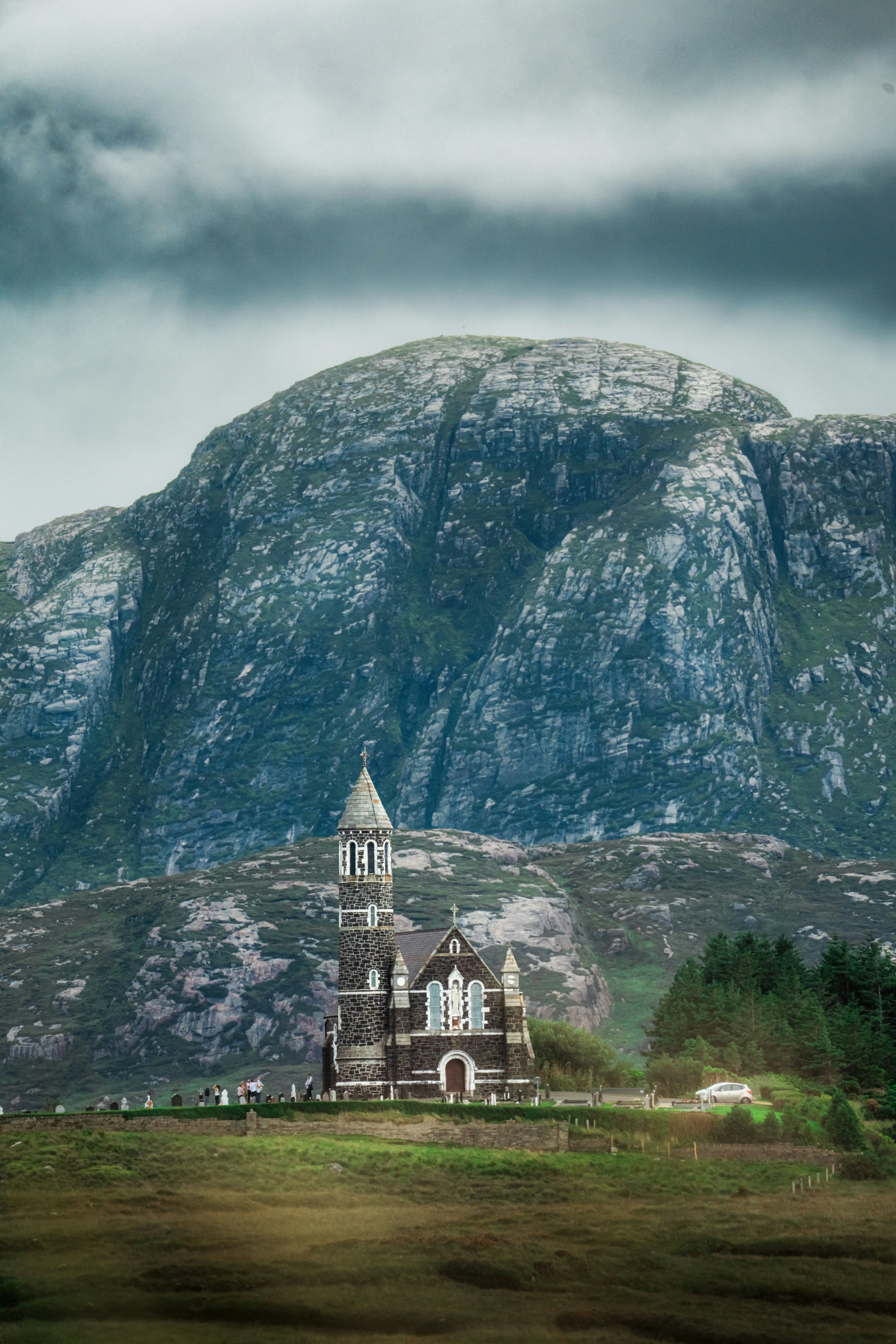 Stone Chapel at the Foot of a Majestic Carved Mountain
