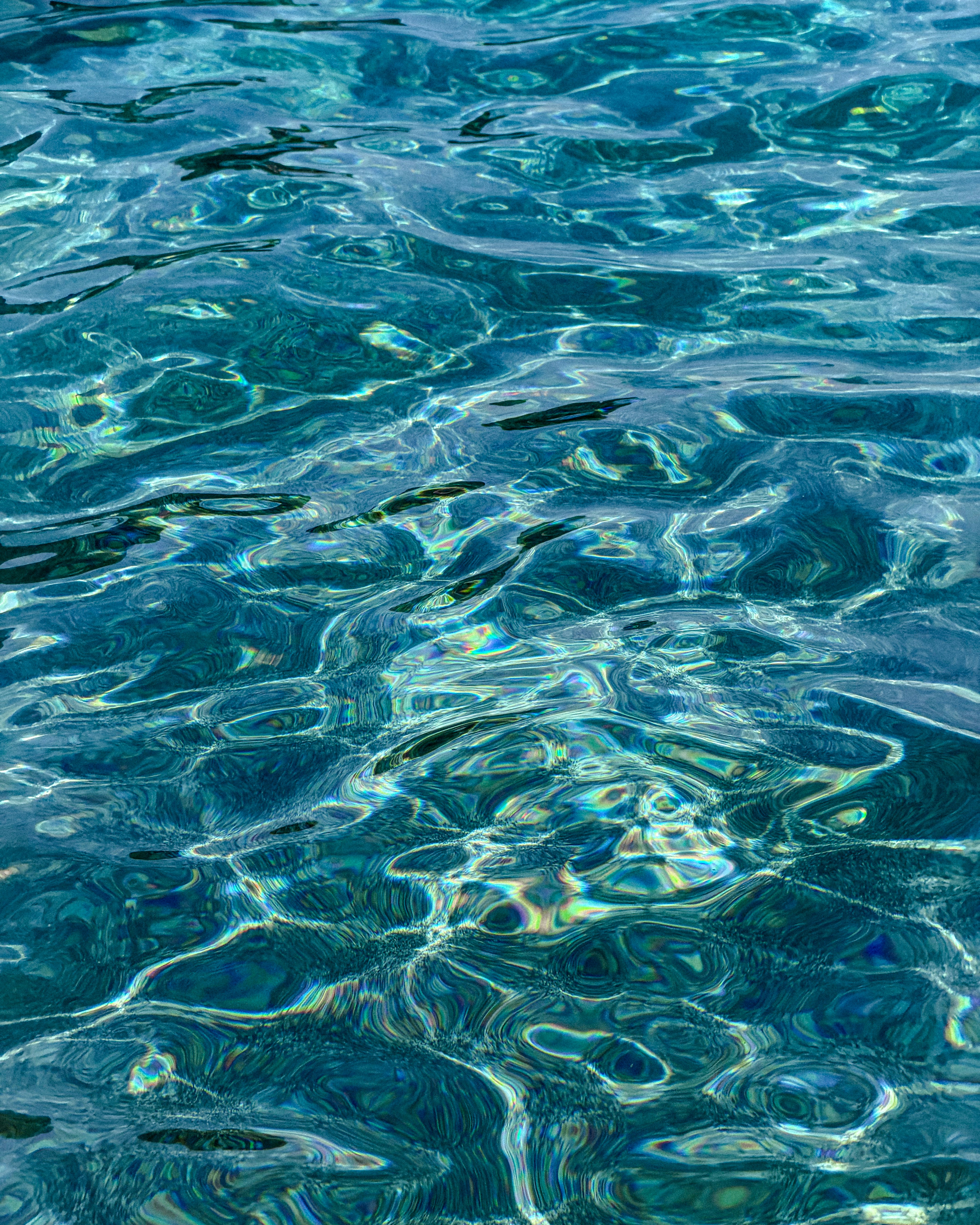 Sunlit Ripples: A Close Dance with Turquoise Water