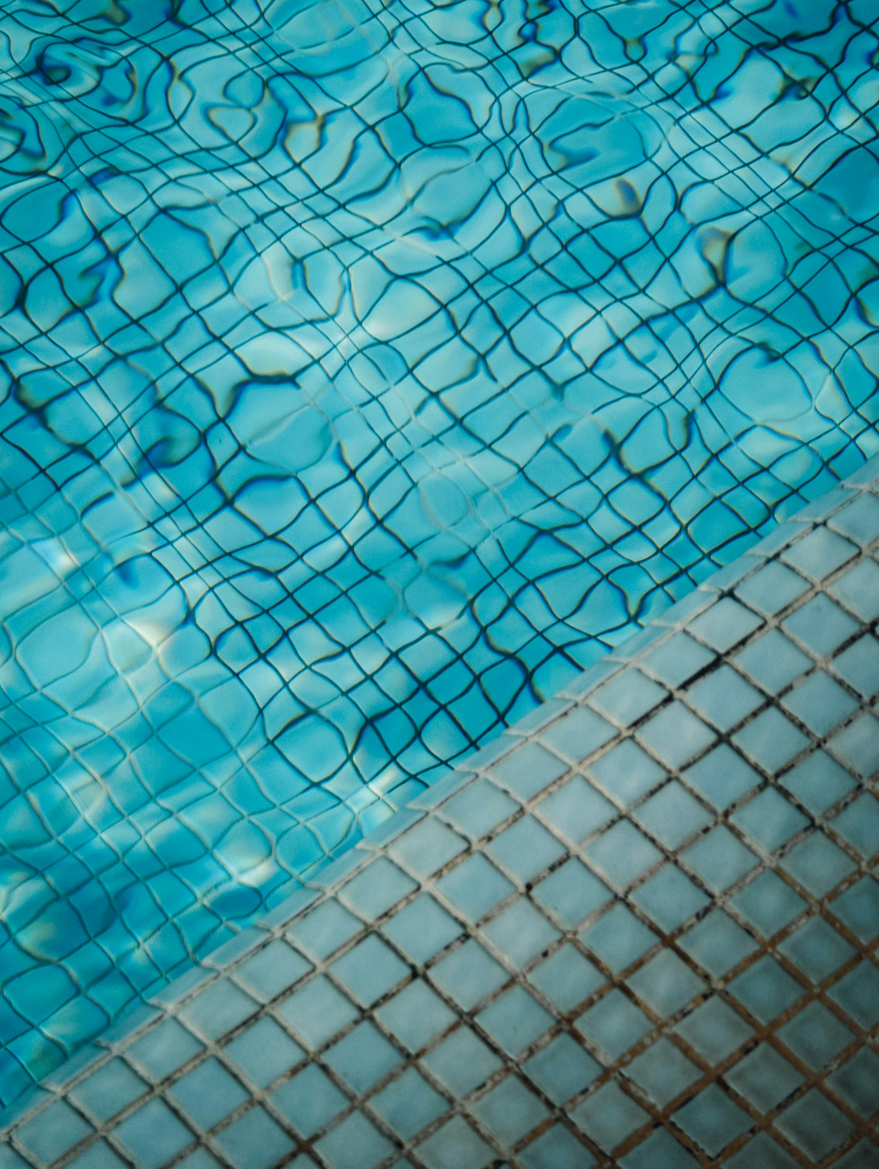 Blue Mosaic Edge: Tiles Meet Pool Ripples
