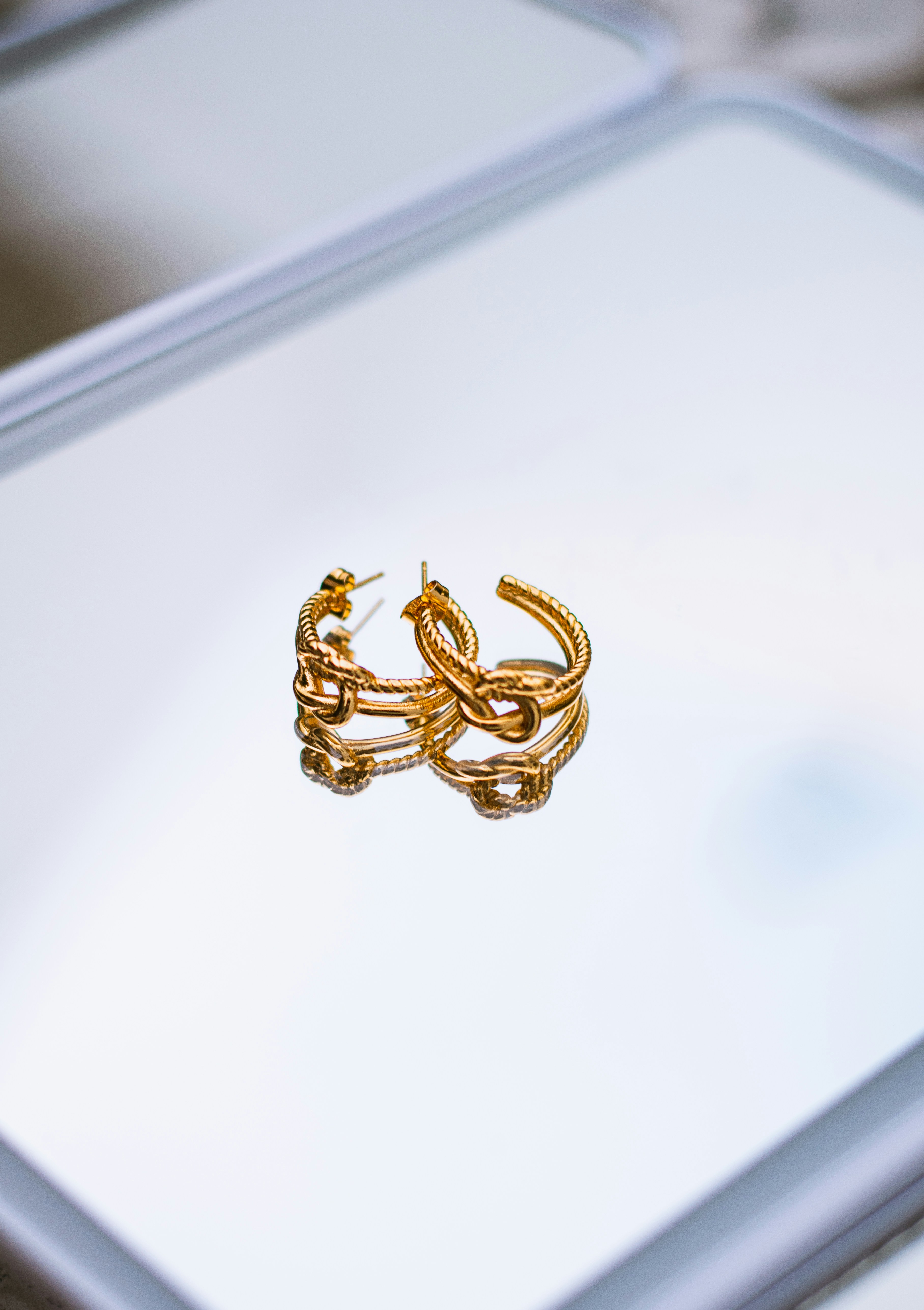 Golden Rings on a Silver Mirror: Reflections of Elegance