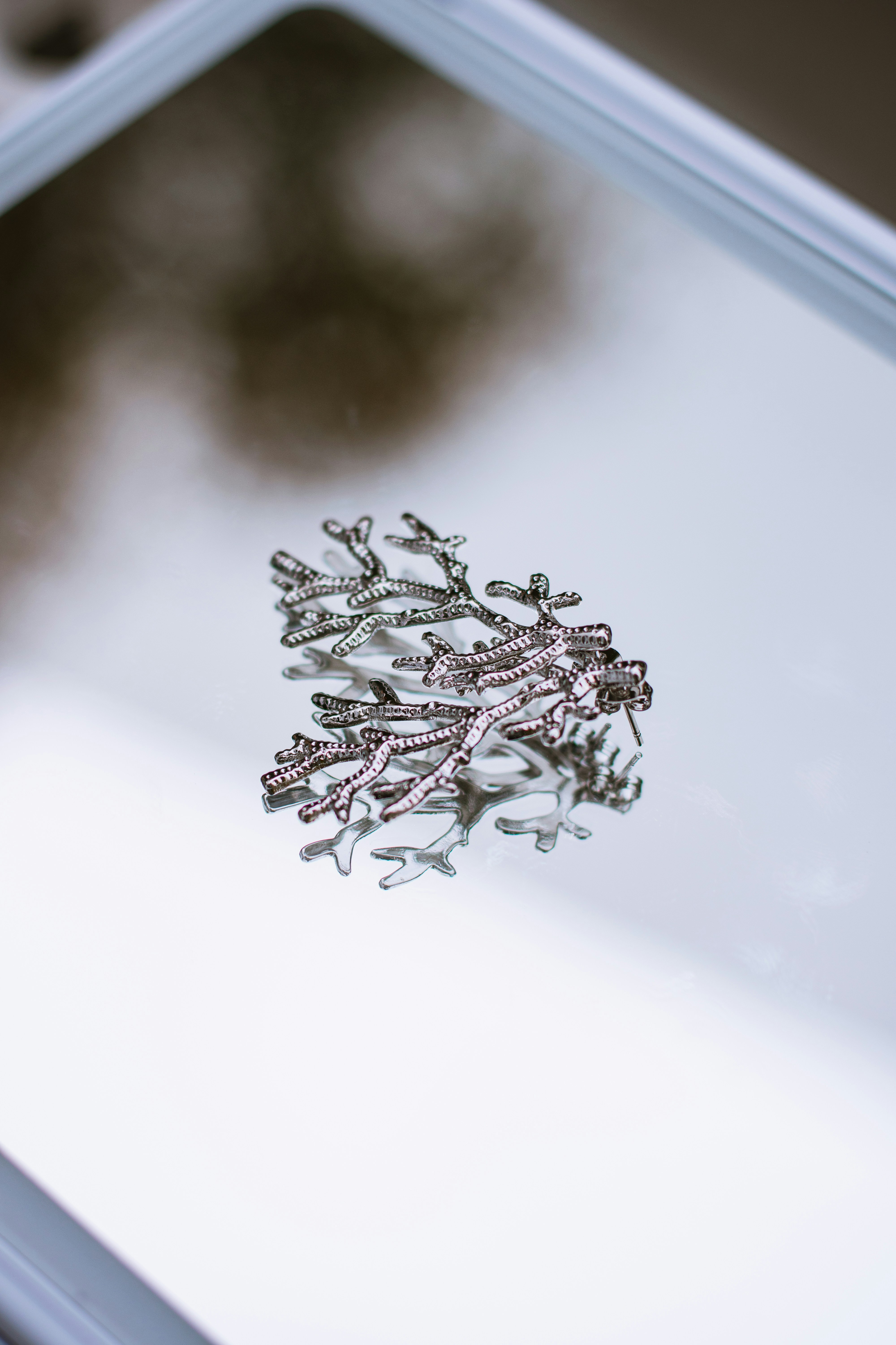 Ice Crystal Ballet: a delicate snowflake resting on glass