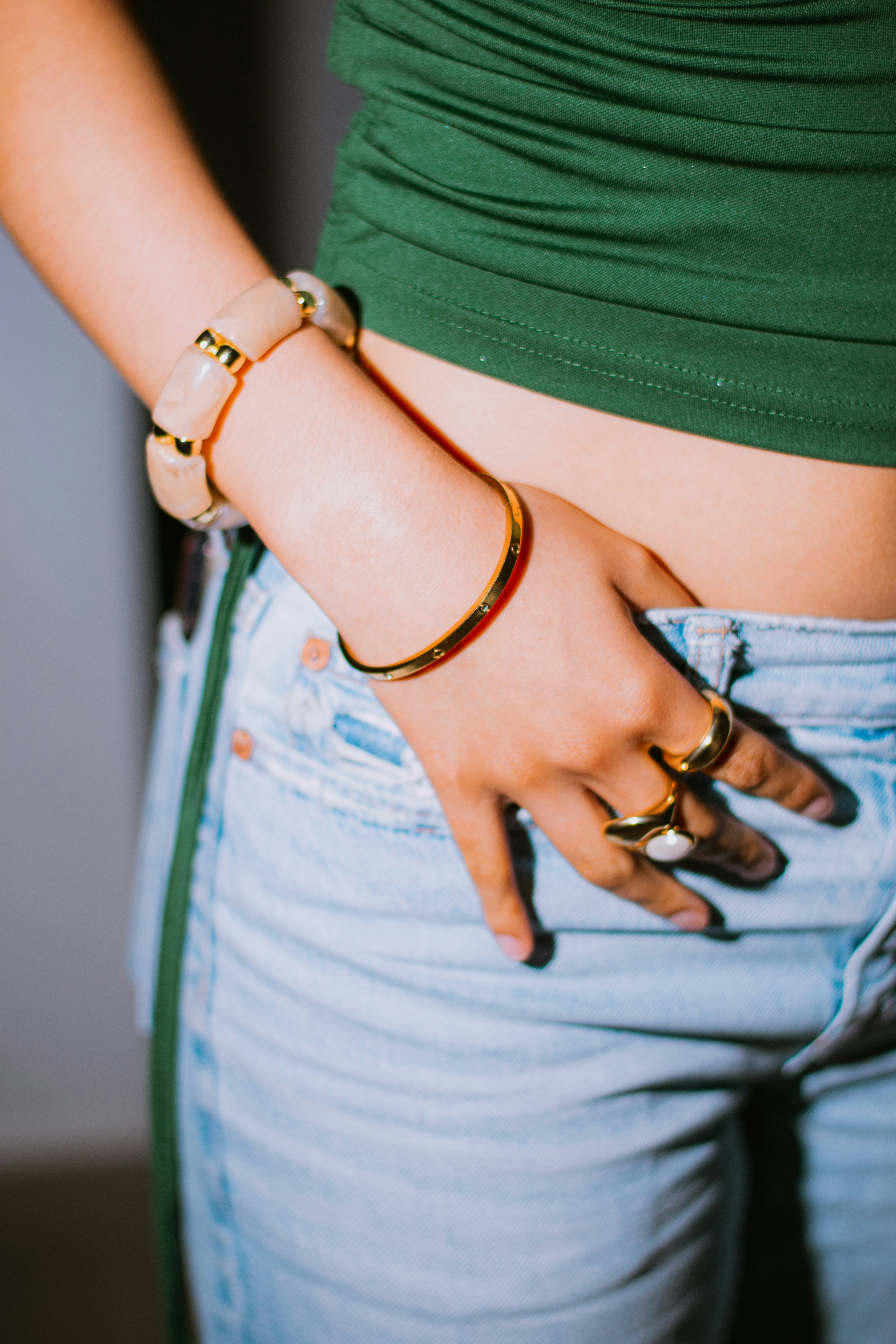 Green Crop and Golden Adornments: A Close-Up of Style