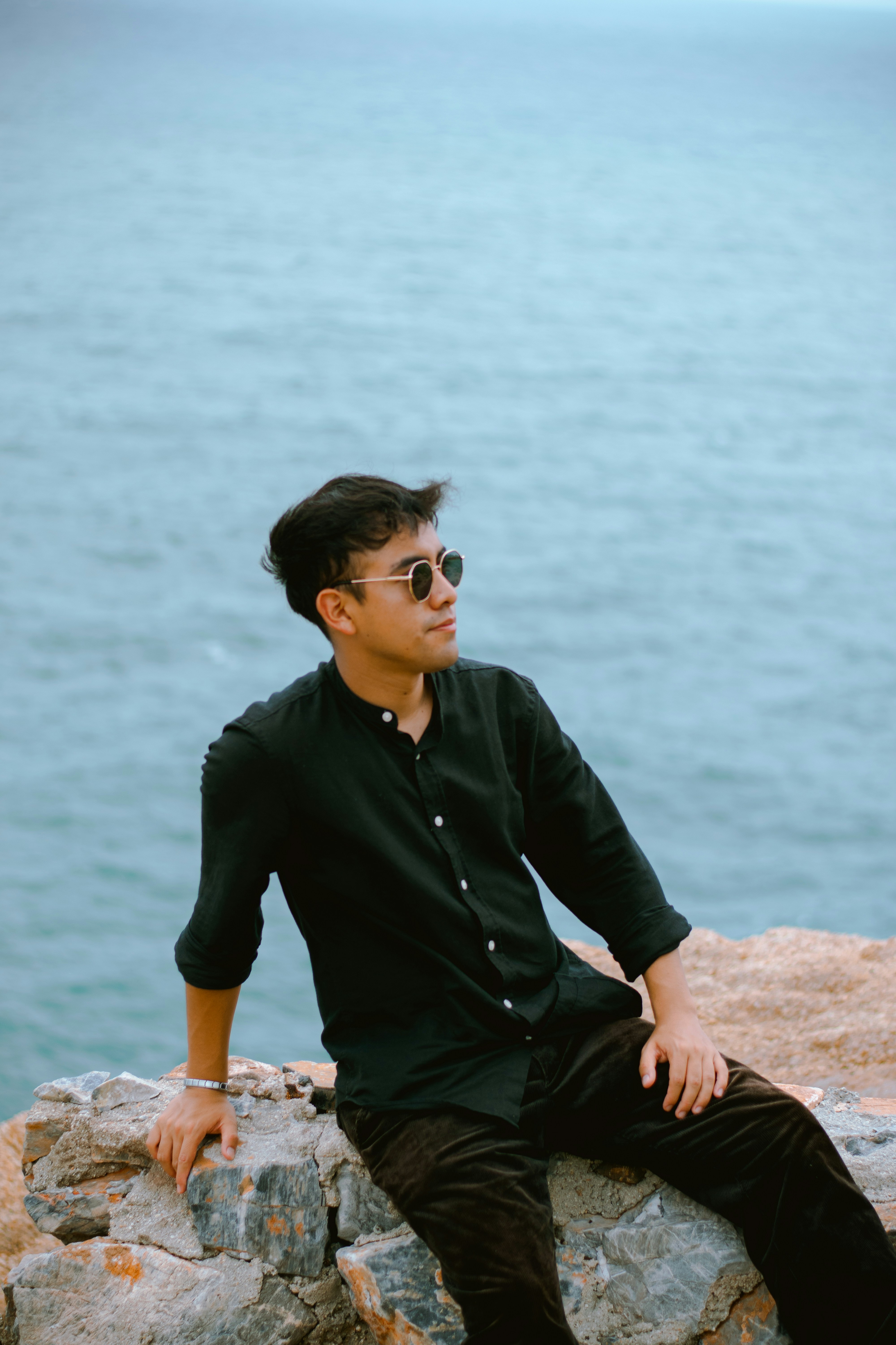 Coastal Confidence: A Quiet Moment on the Rocks