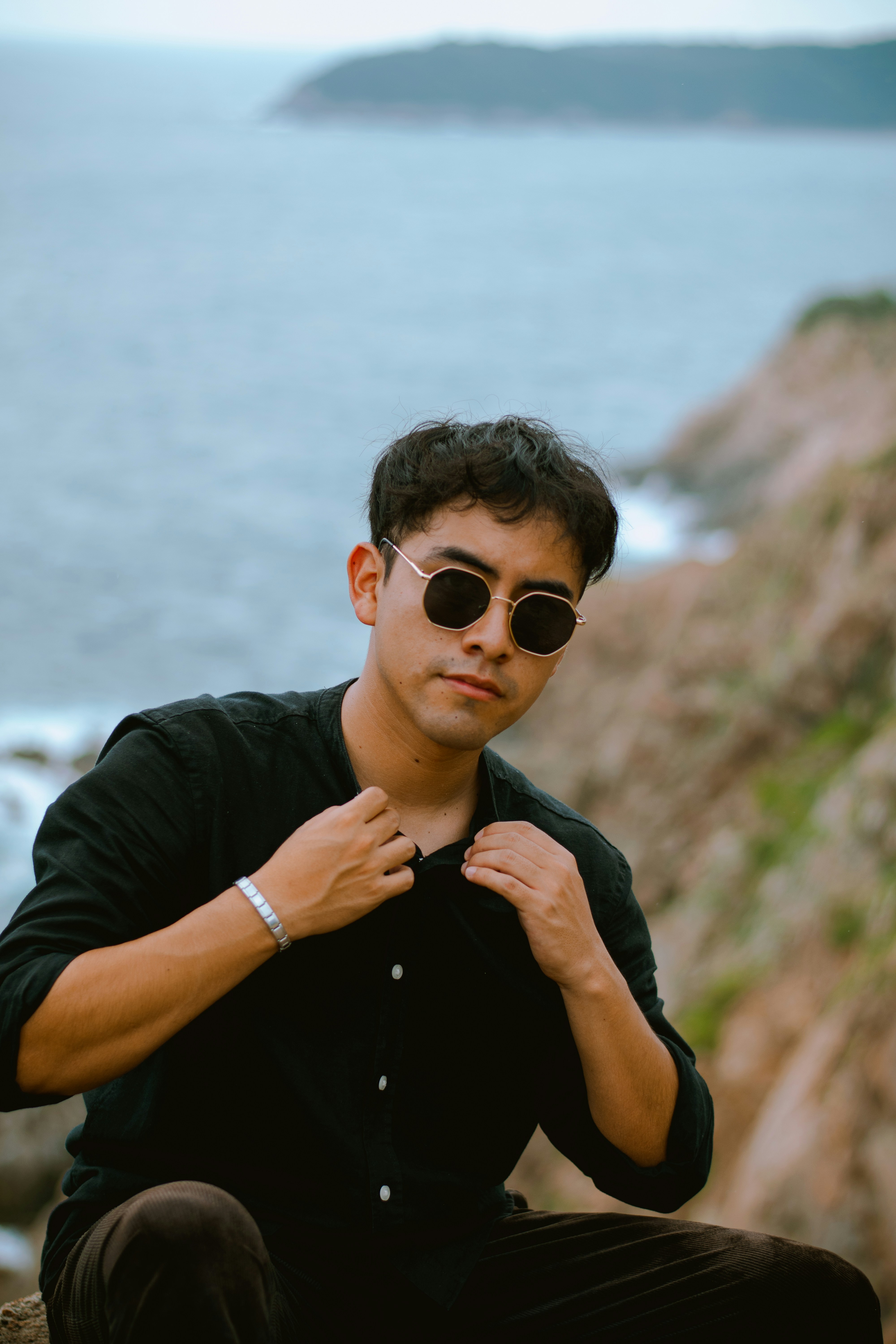 Allure on the Cliffside: A Moment in Sunglass Silence