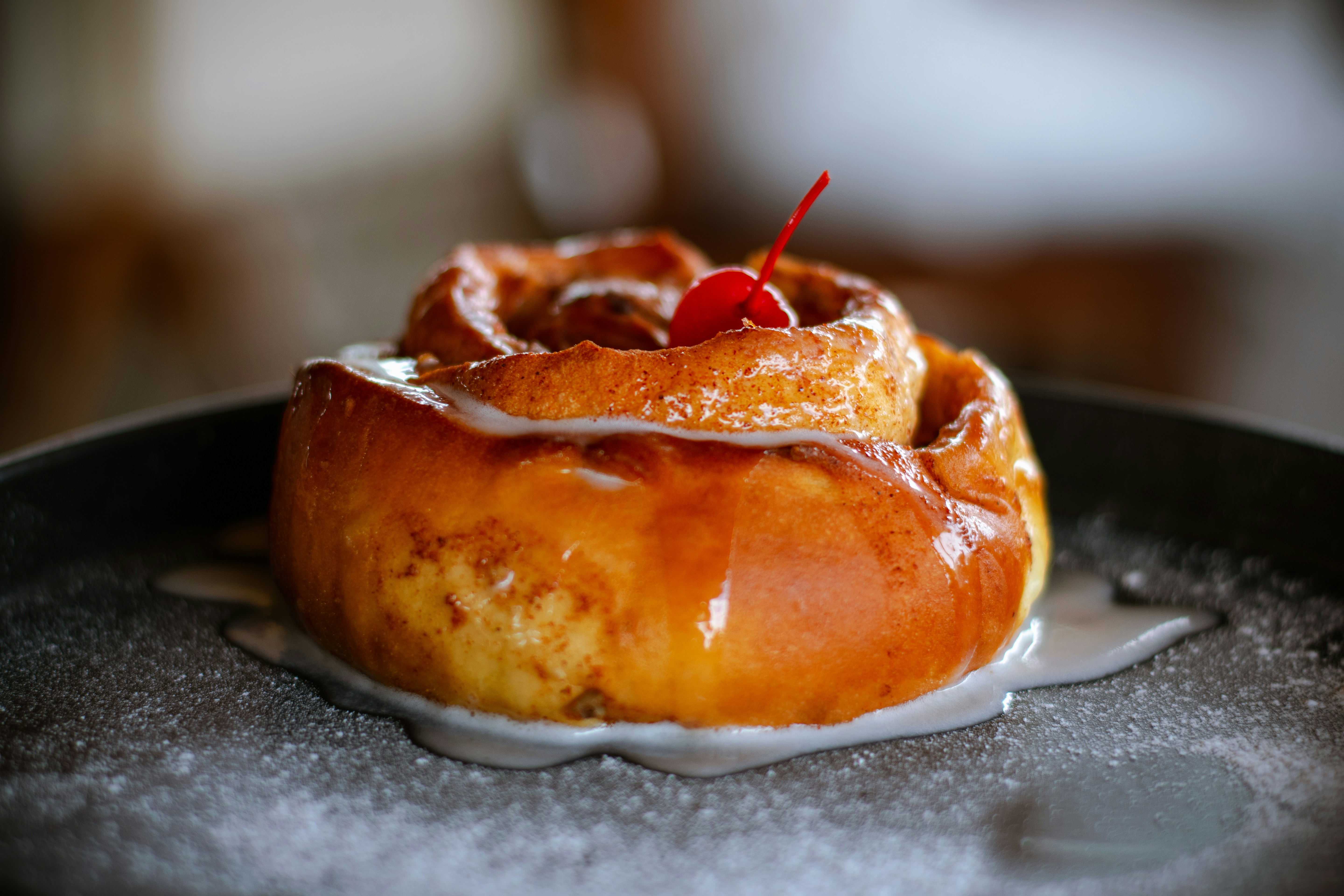Sugared Spiral: Cinnamon Roll Glazed to Golden Perfection