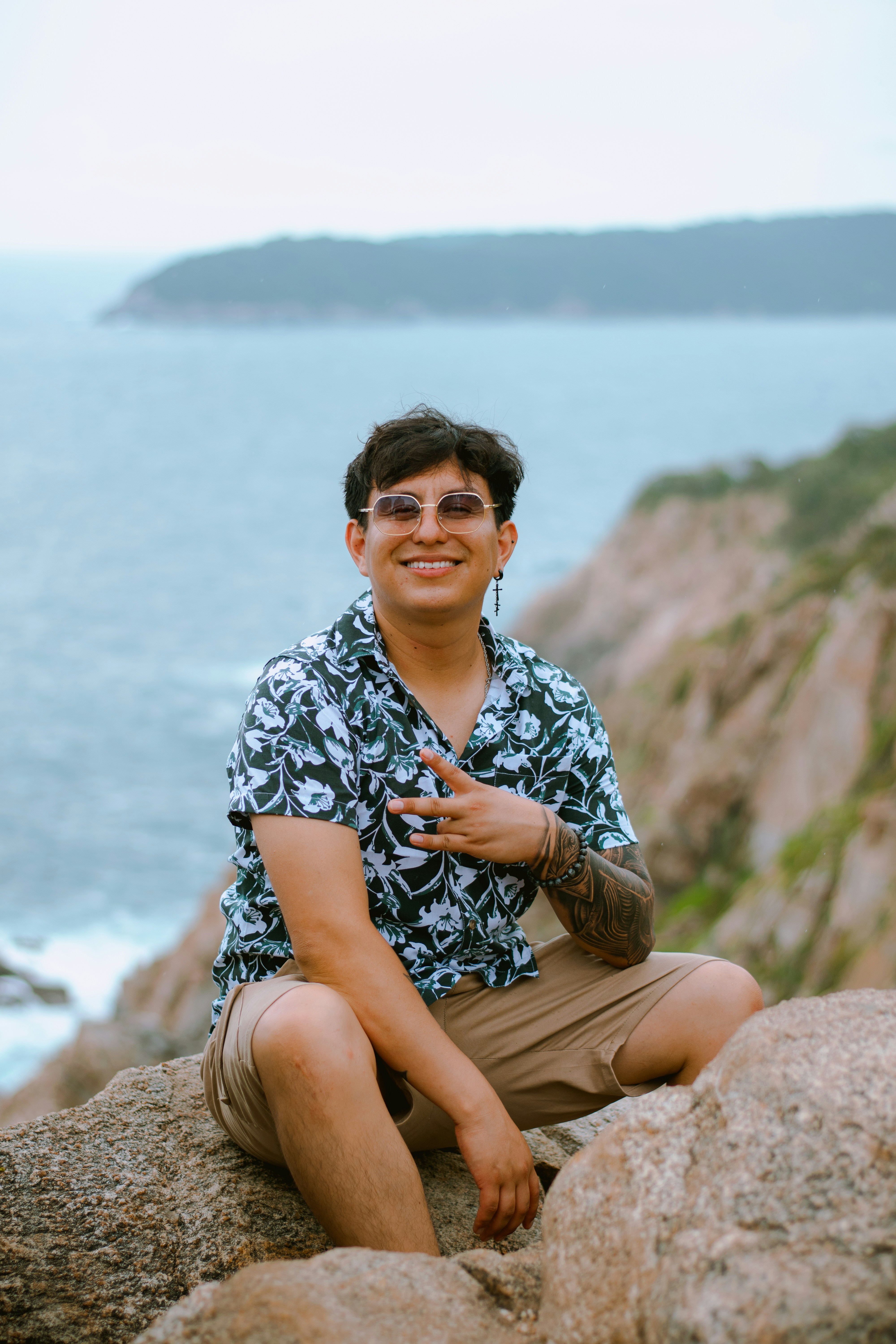 Coastal Confidence: A Smiling Moment Above the Cliffs