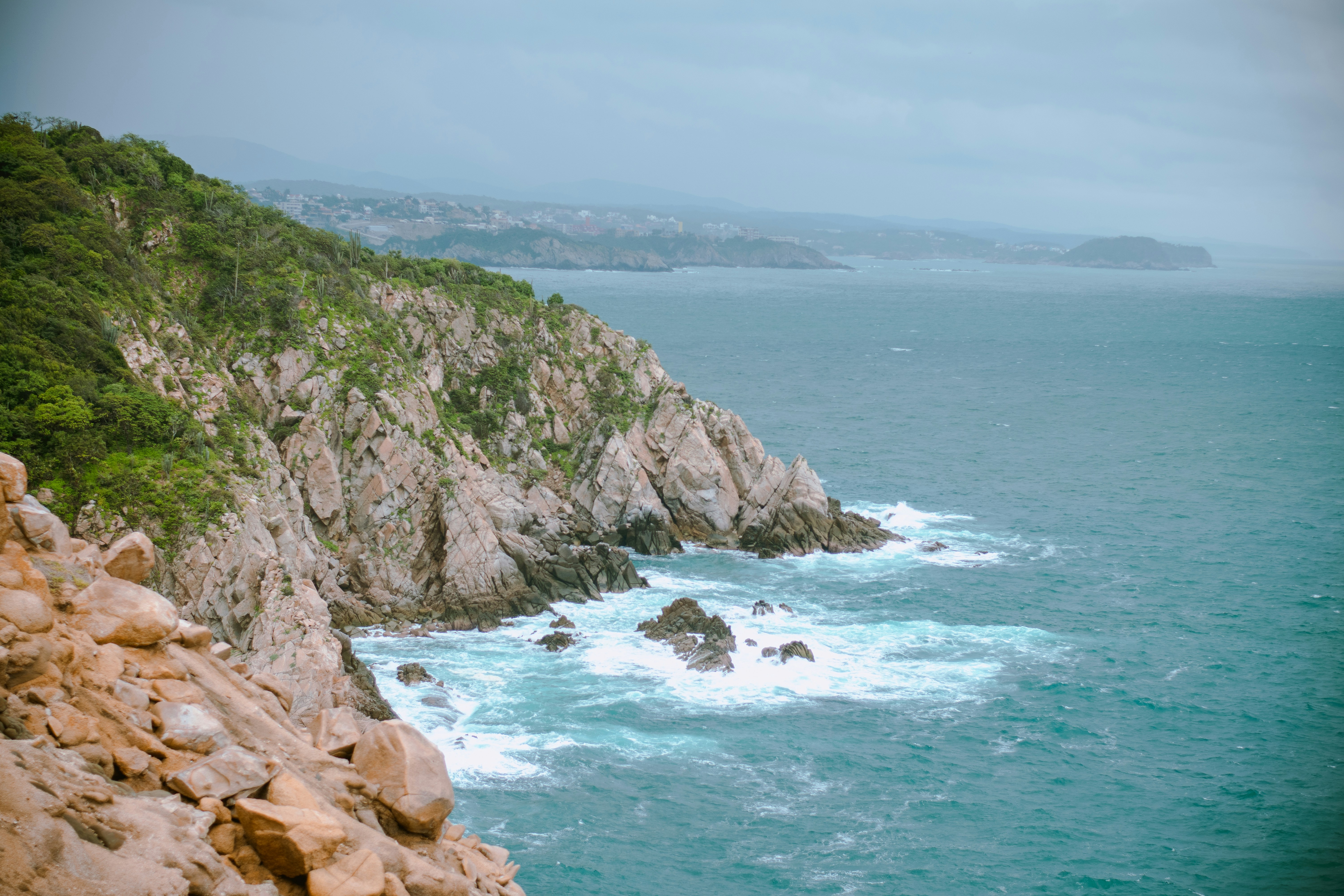 Cliffside Coastline: Rugged Rocks Meet Turquoise Seas