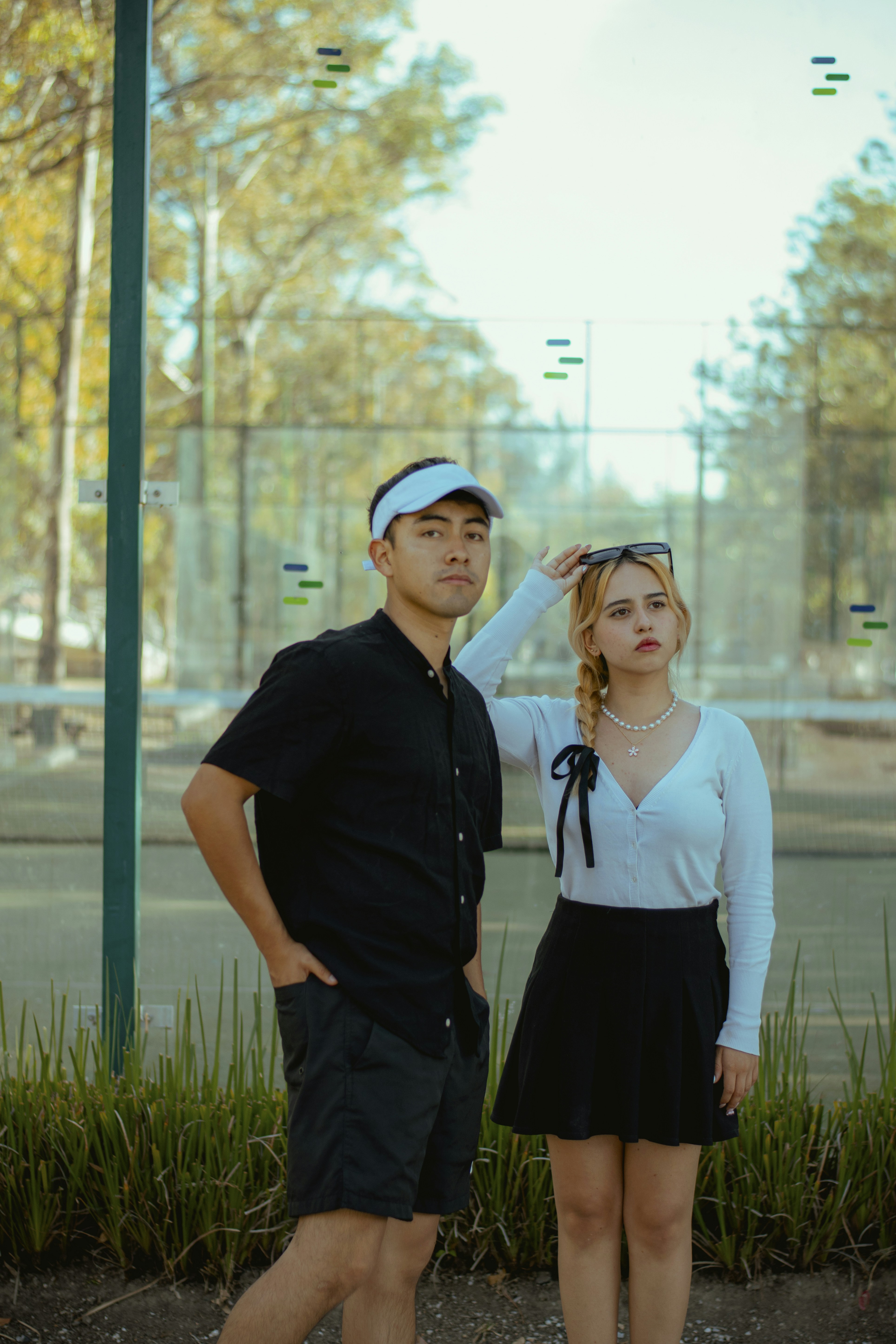 Two stylish center-stage portraits at the bus stop glass