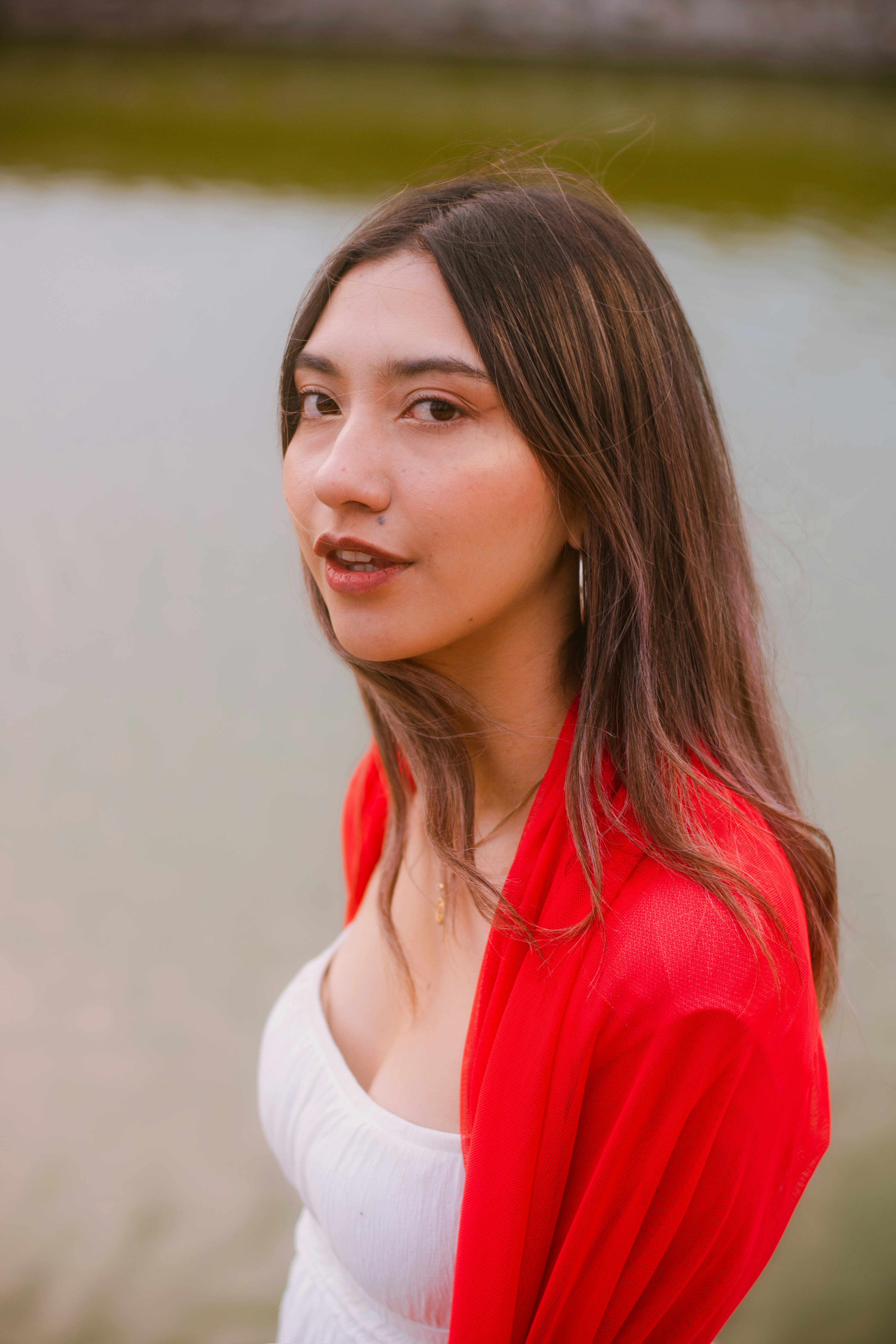 Red-jacket Portrait by a Tranquil Waterside