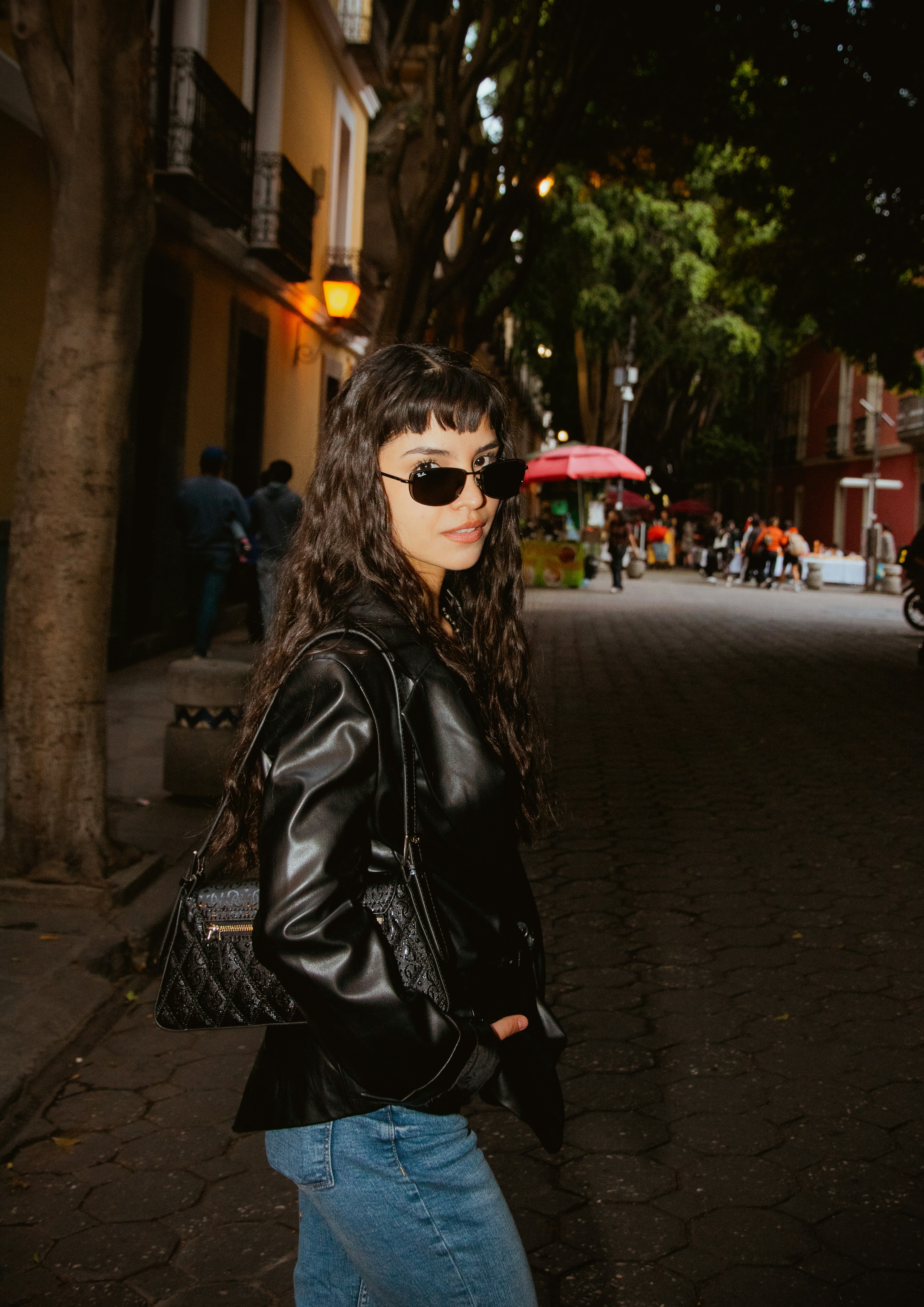 Midnight Street Style: A Leather-Clad Muse Under Warm City Glow