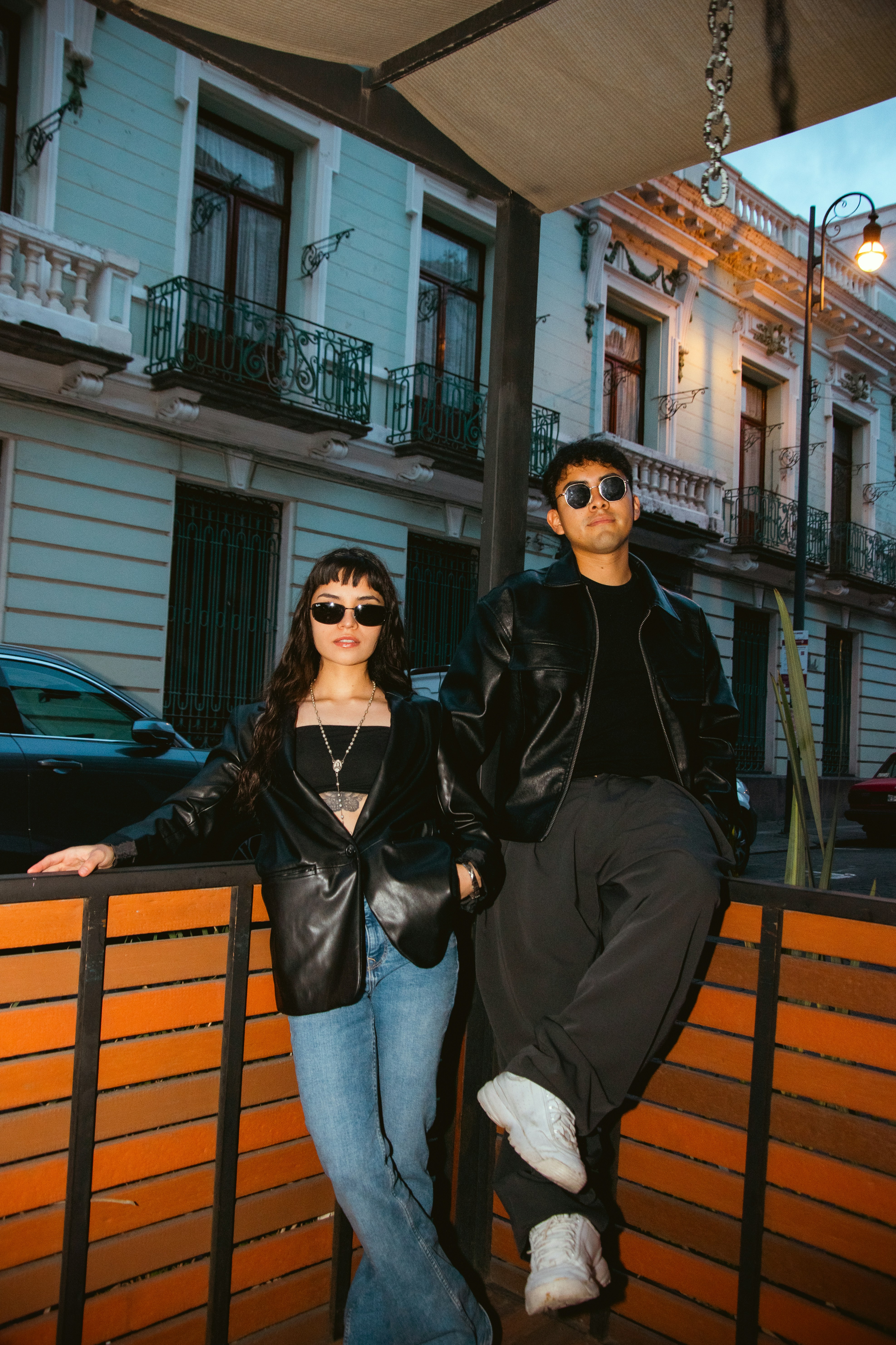 Two Neon-Outfit Rebels Share the City Edge