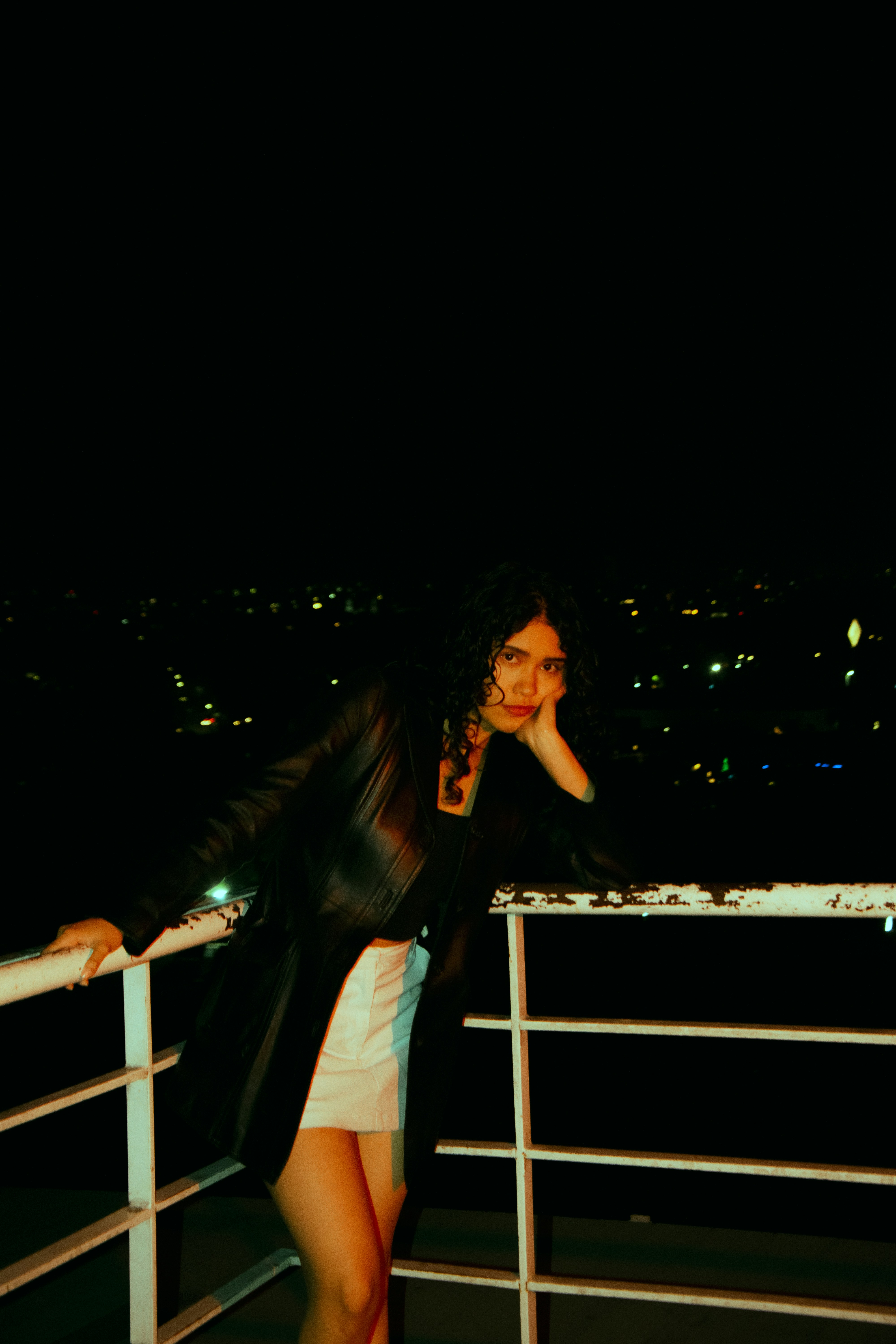 Night Balcony Confidante: A Cityscape Gaze