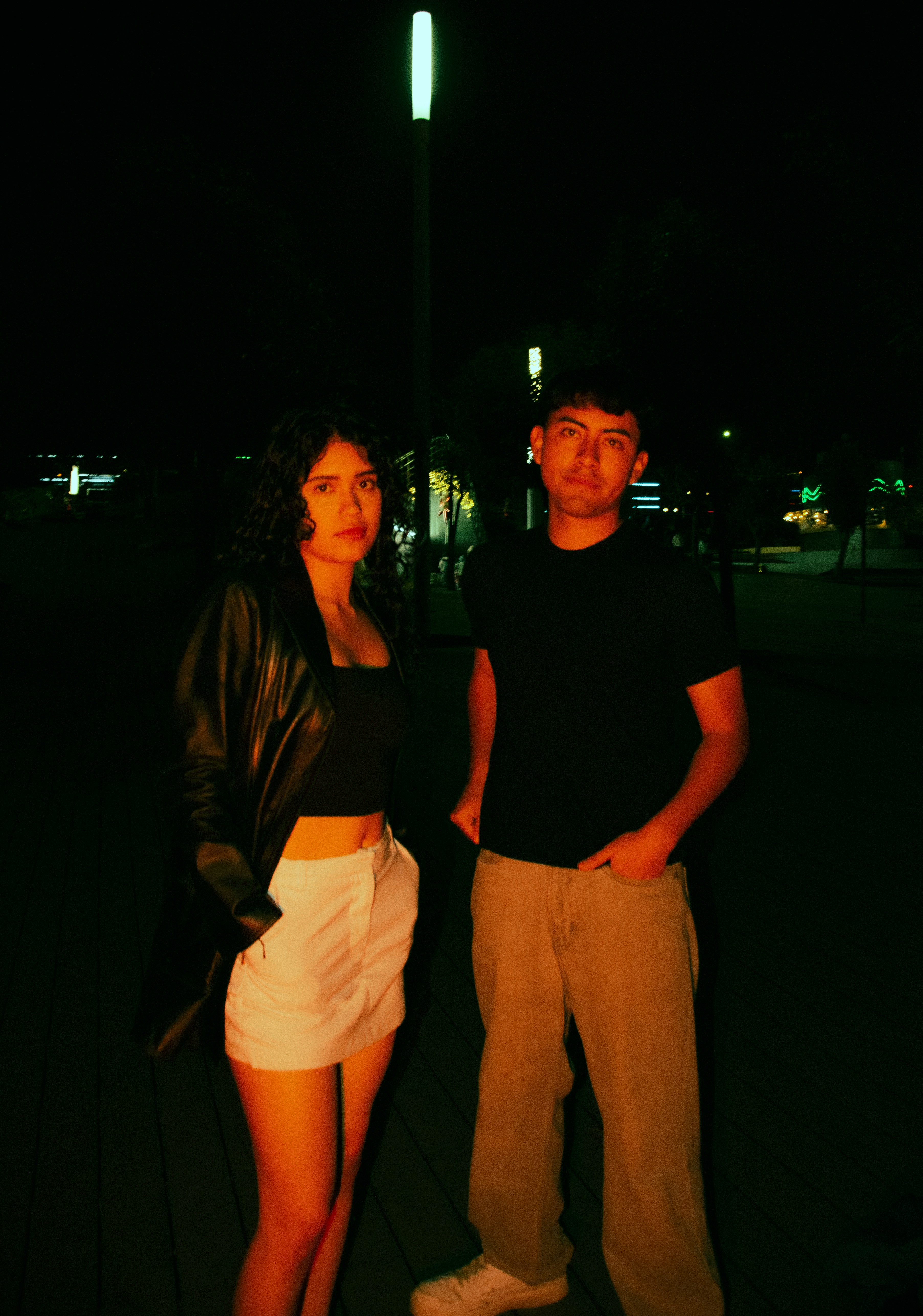 Night Duo: Quiet Confidence Under Neon Streetlights