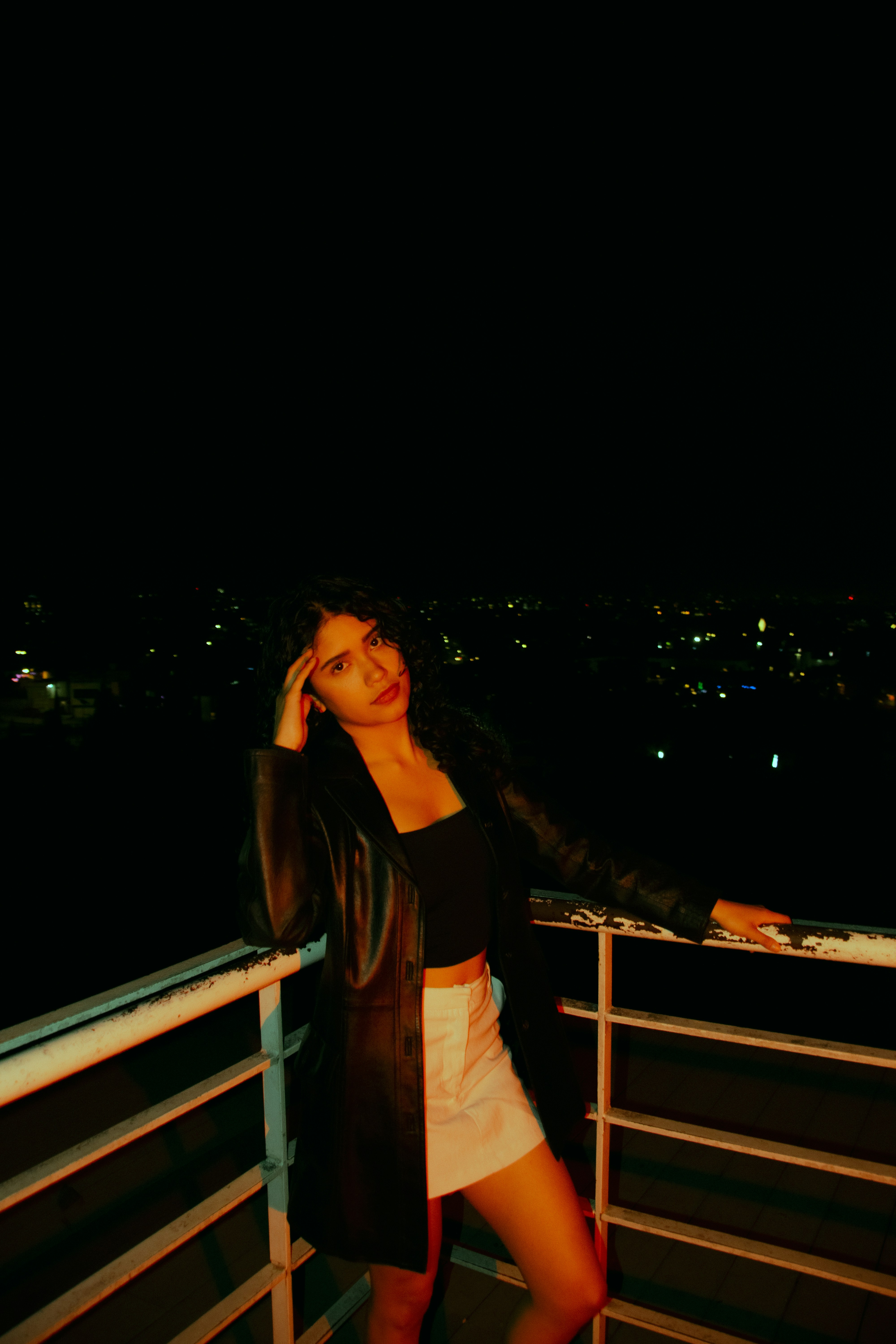 Night Skyline Siren: A Confidence Pose on the Balcony