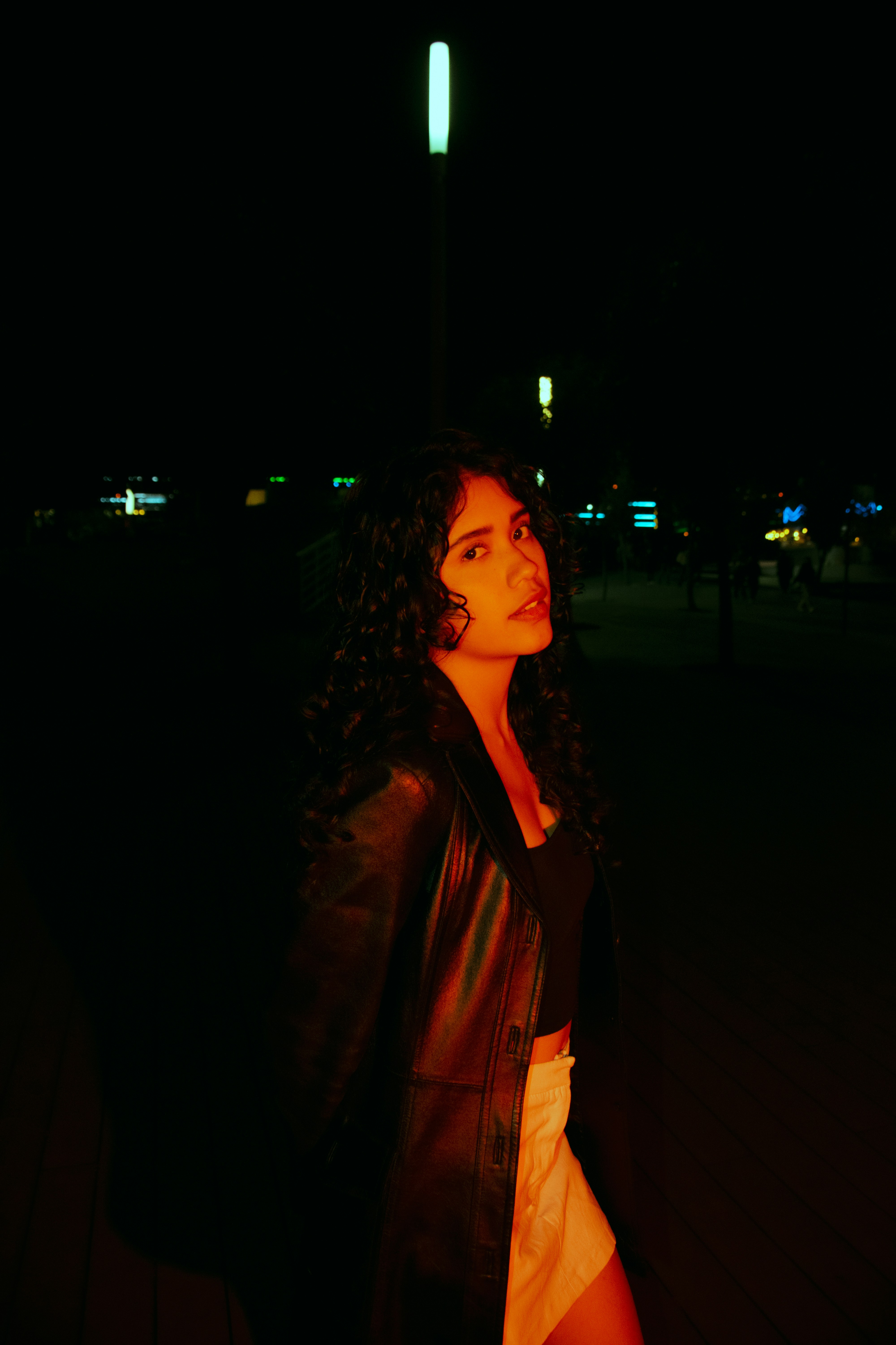 Midnight Portrait Under Neon Pines