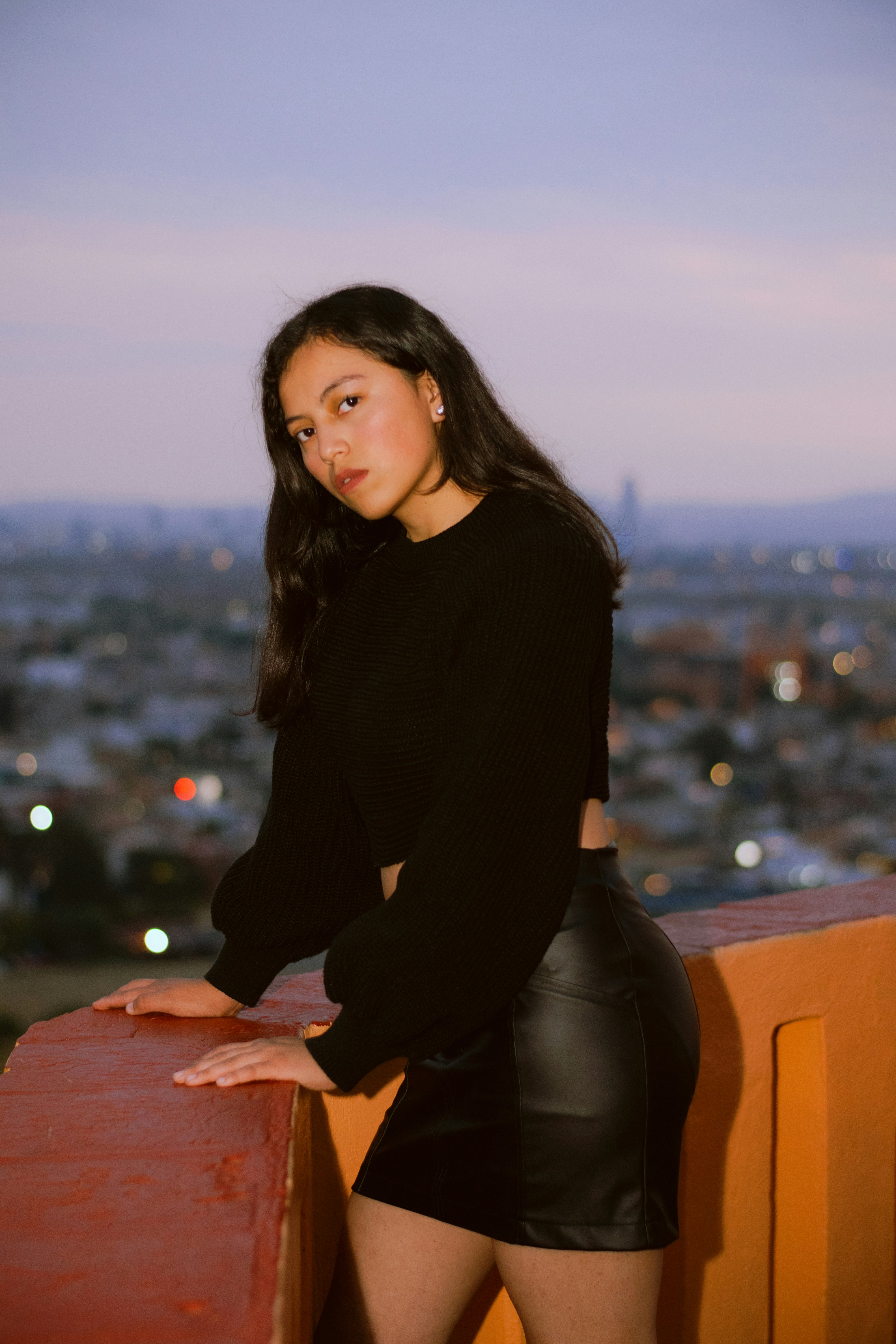 Nightfall on the Rooftop: A Quiet Portrait in Black Knit