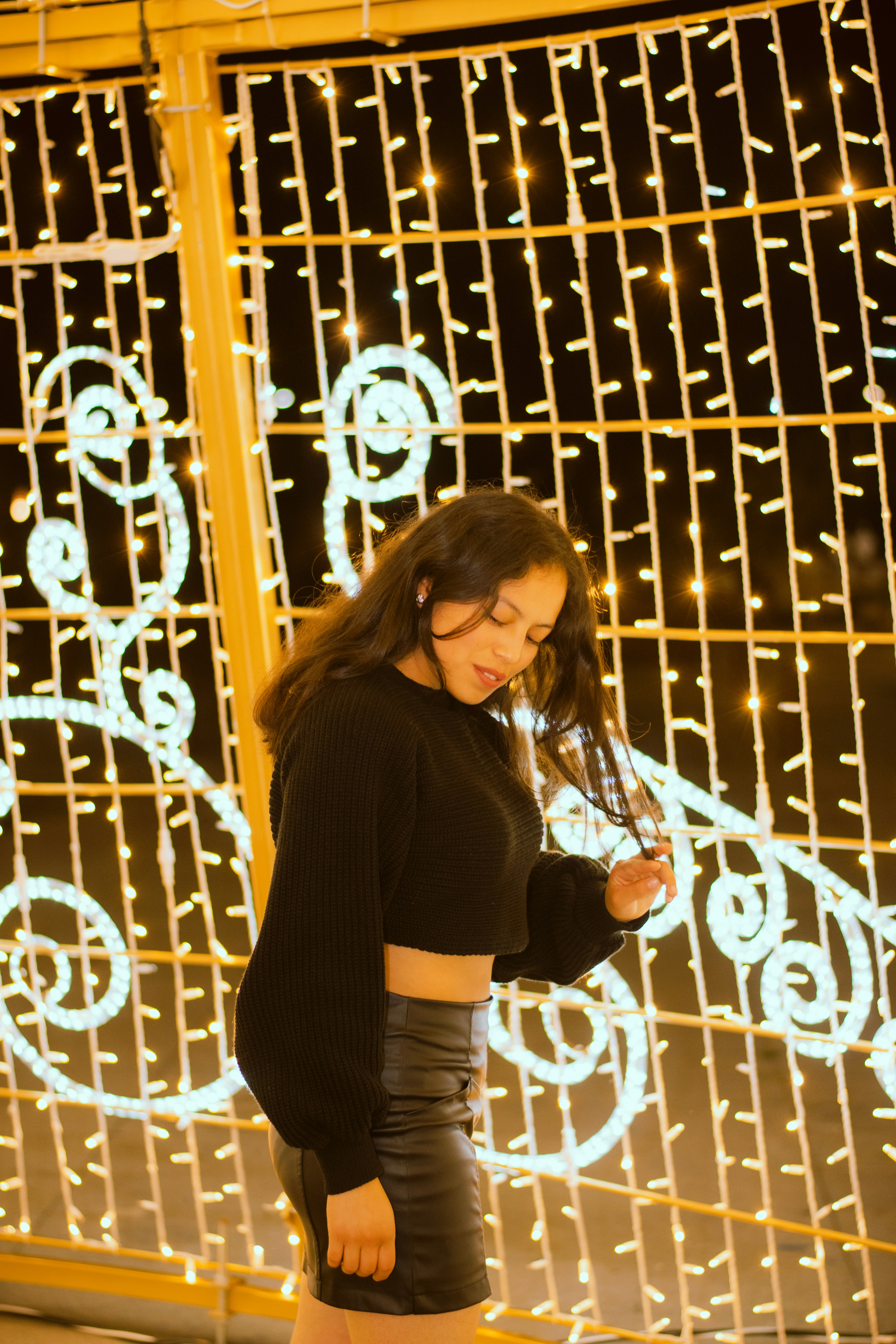 Nighttime Serenade of Lights: A Portrait Under Festive Ornaments