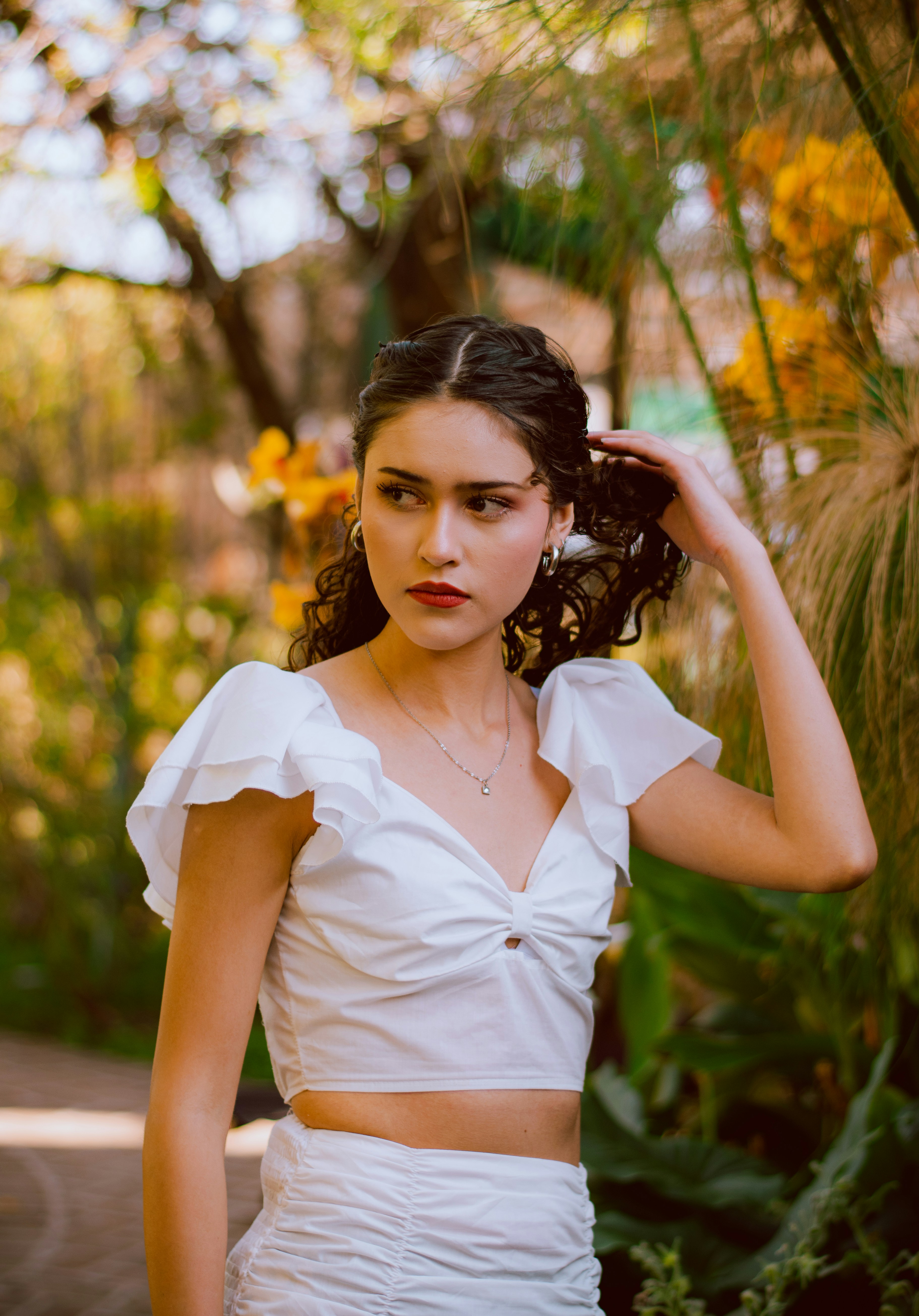 White-sleeved Serenade in a Sunlit Garden