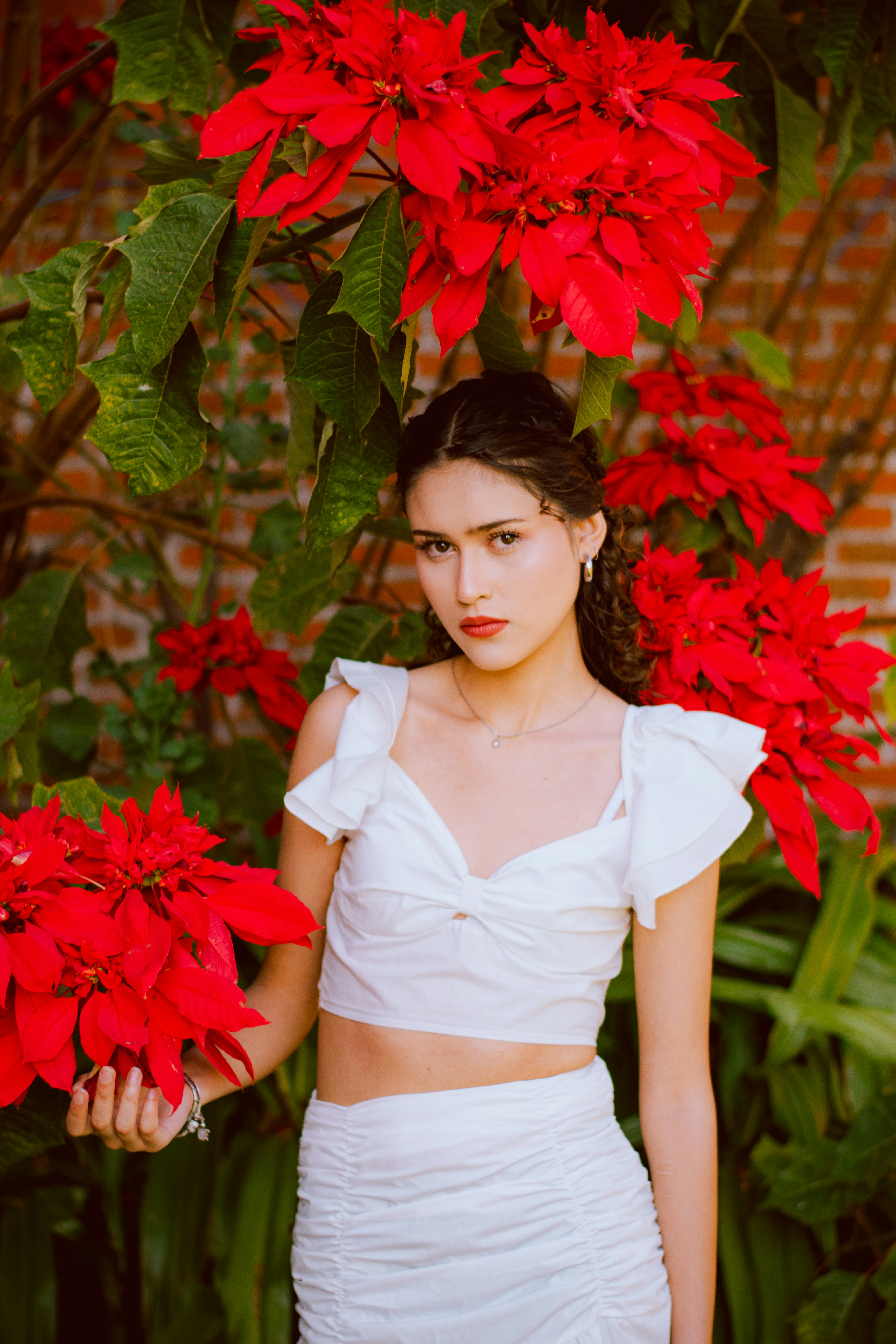Garden Portrait Under Crimson Blooms